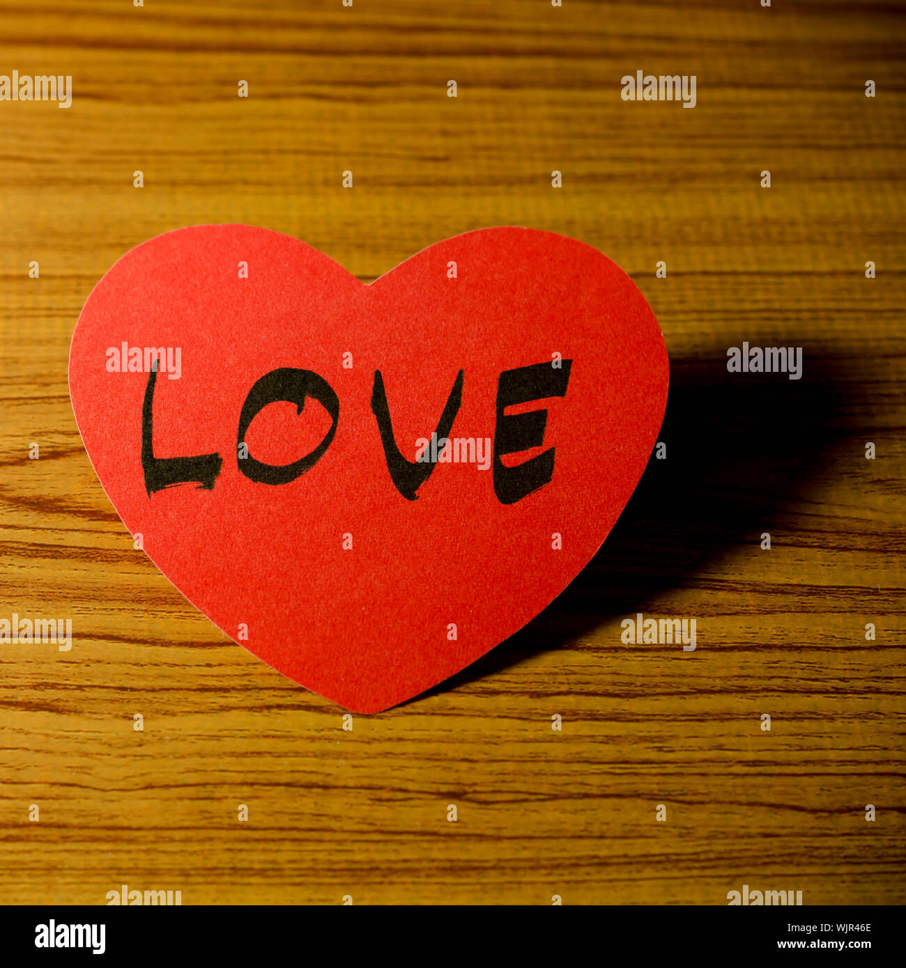 red heart word LOVE on wood vintage stlye background Stock Photo - Alamy