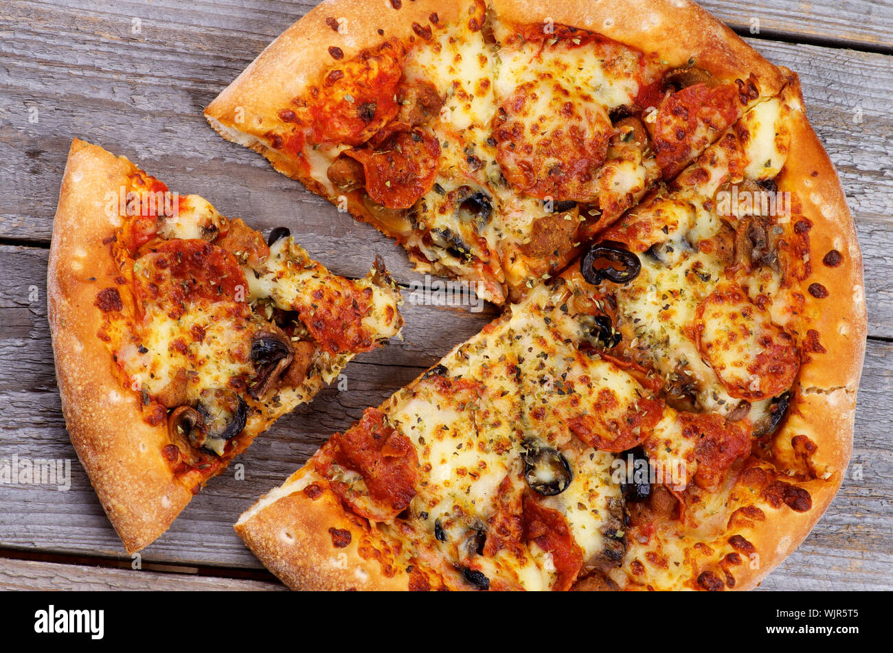 Full Body and Slice of Freshly Baked Pepperoni Pizza with Black Olives ...