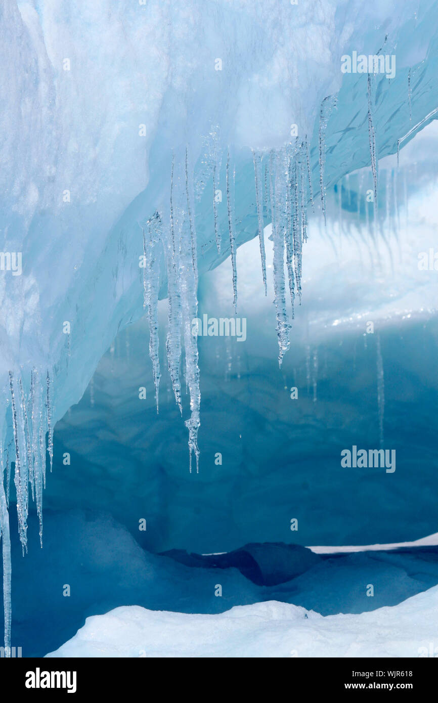 Ice hanging from an edge of an iceberg Stock Photo - Alamy