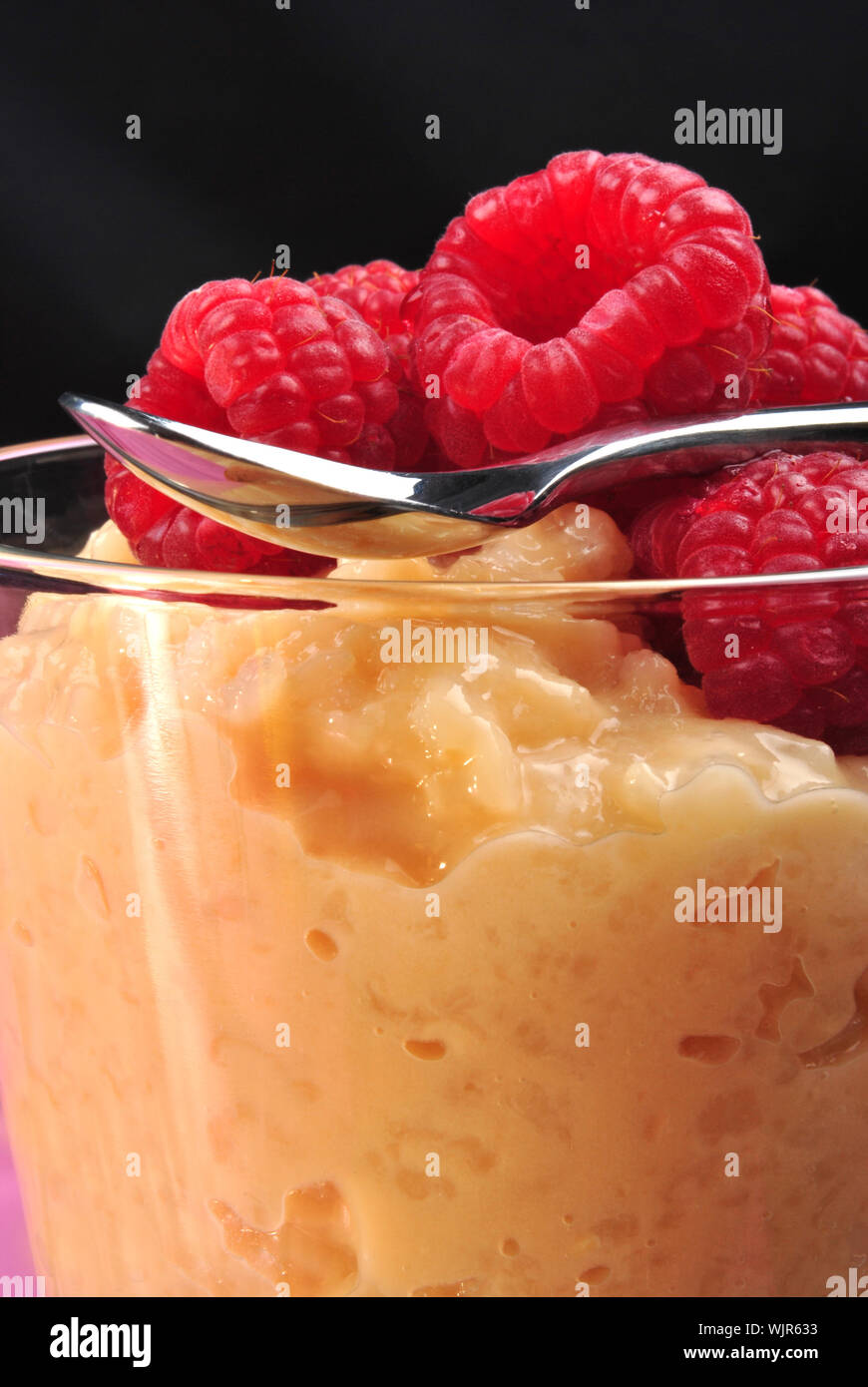 home made creamed rice pudding with raspberries Stock Photo - Alamy