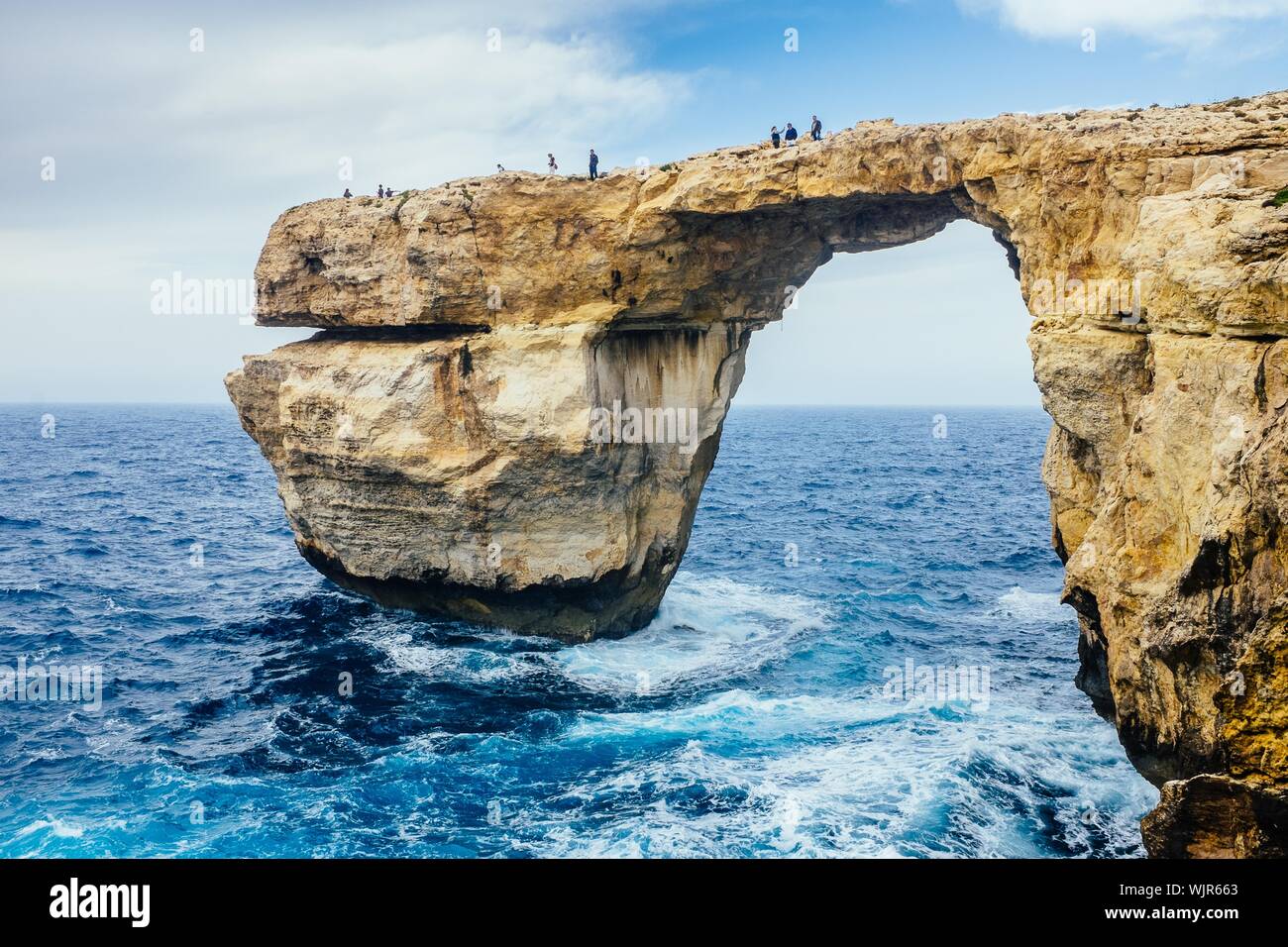 Beautiful shot of the natural arch of Azure Window on the body of the ...