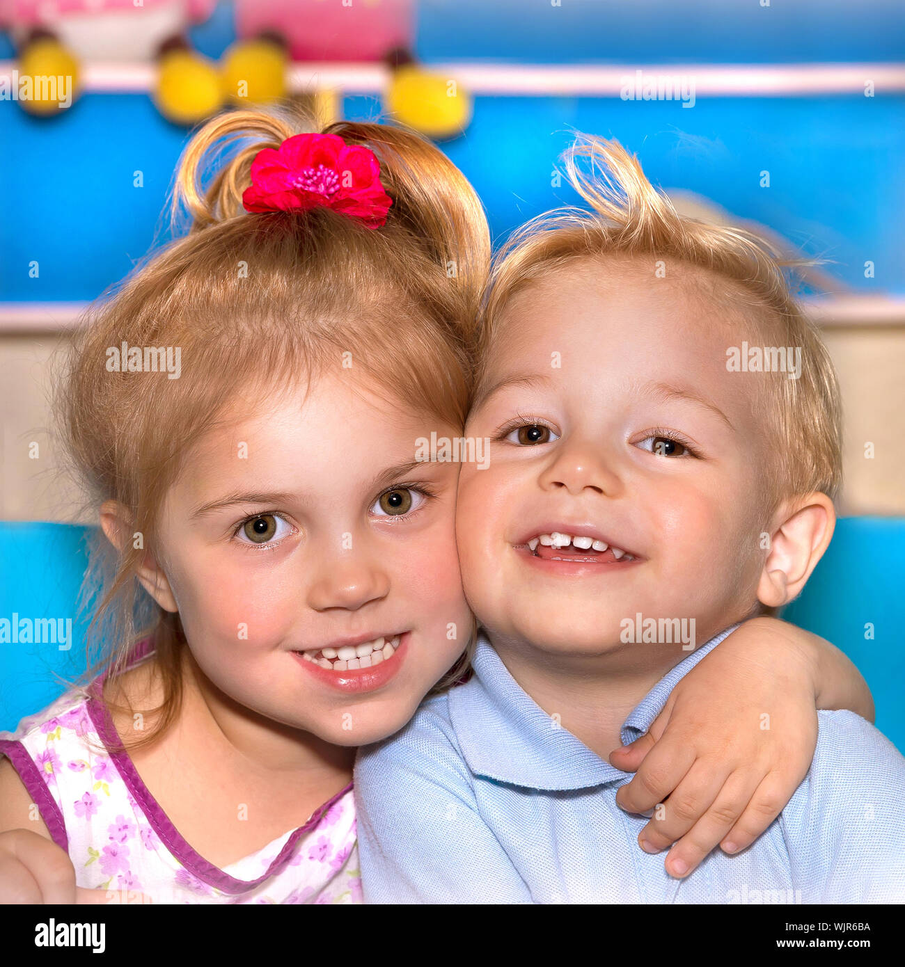 Closeup portrait of two cheerful child hugging each other, adorable ...