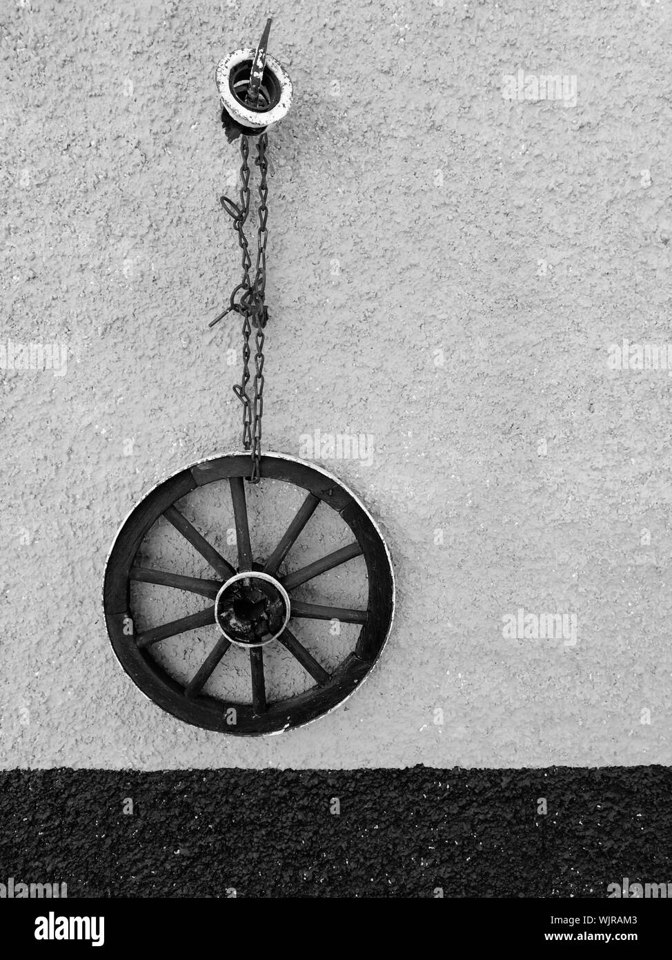 The wheel hanging on the wall hi-res stock photography and images - Alamy
