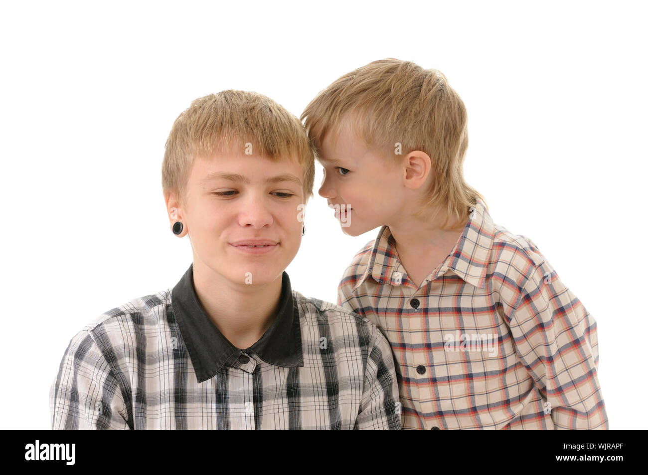 Two brothers embrace isolated on white background Stock Photo - Alamy