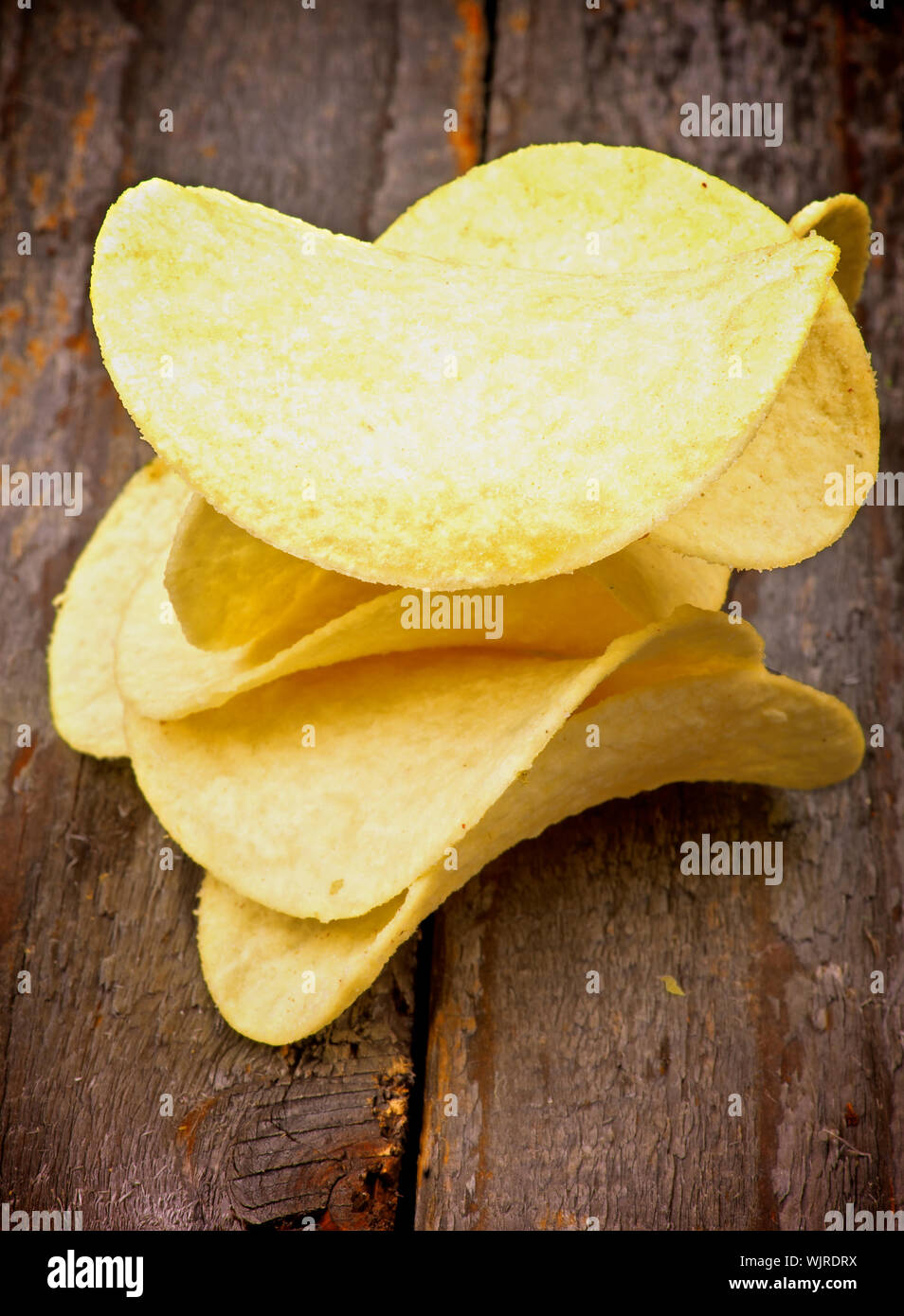 Pile of Crunchy Potato Chips isolated on Rustic Wooden background Stock ...