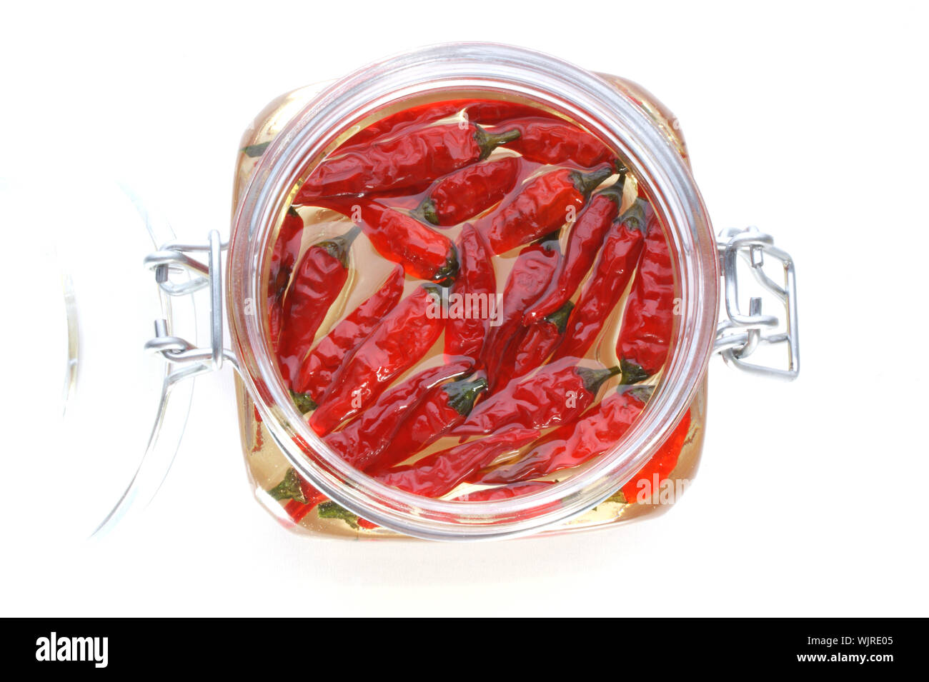organic red chili in a jar with oil Stock Photo - Alamy