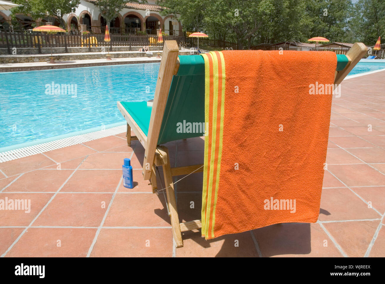 Relaxing bed by the luxury swimmingpool Stock Photo - Alamy