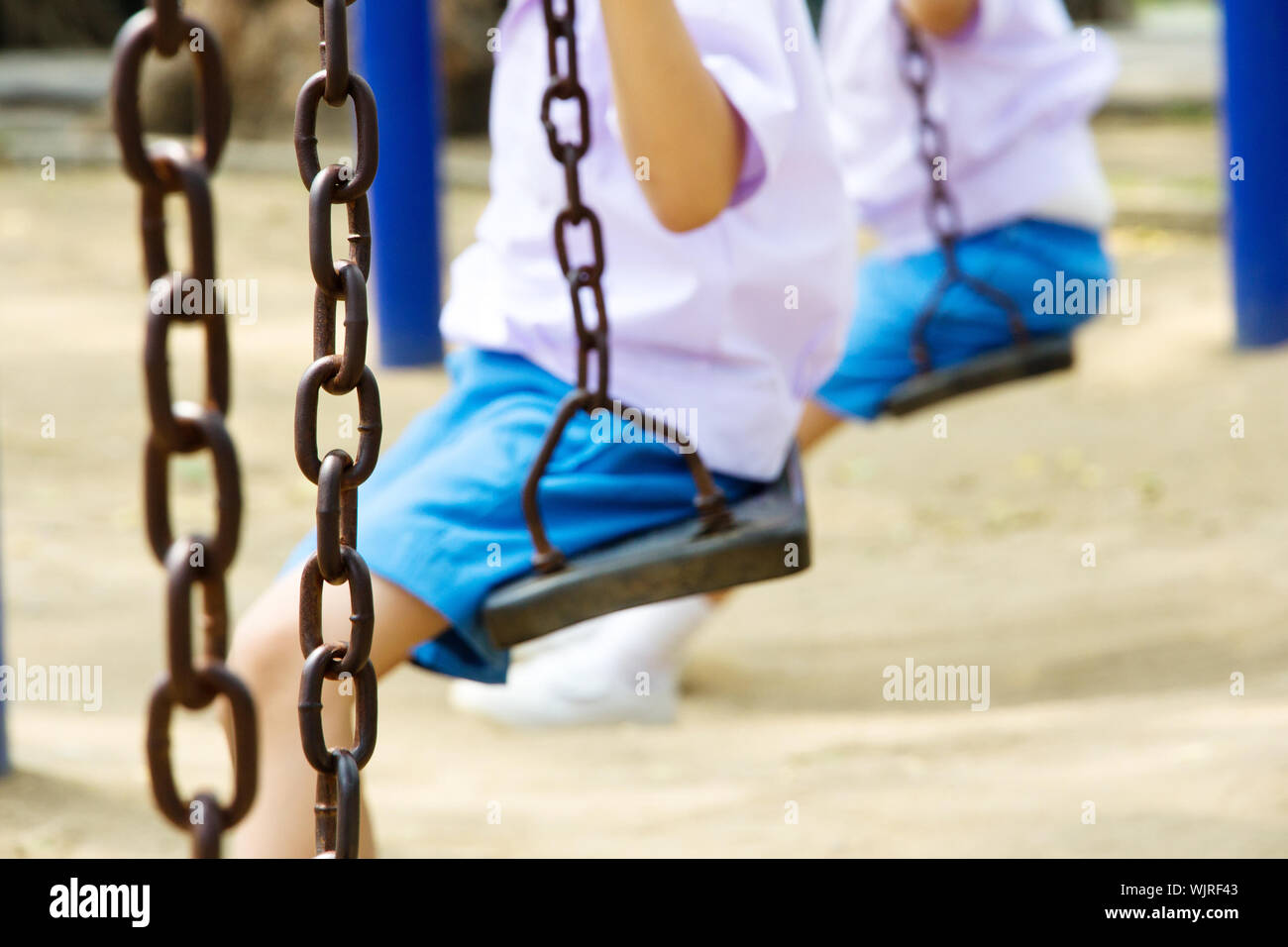 child swinging at a playground Stock Photo - Alamy