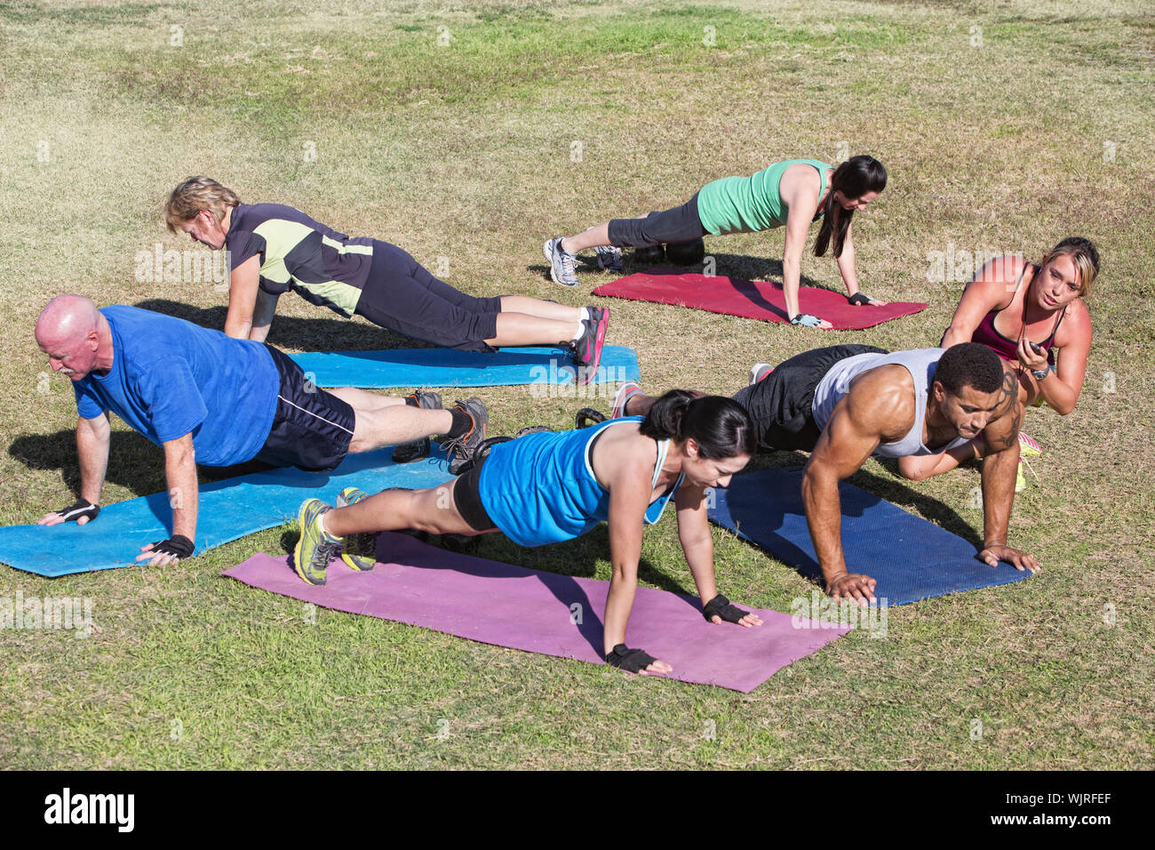 Diverse group of adults in boot camp fitness class Stock Photo - Alamy
