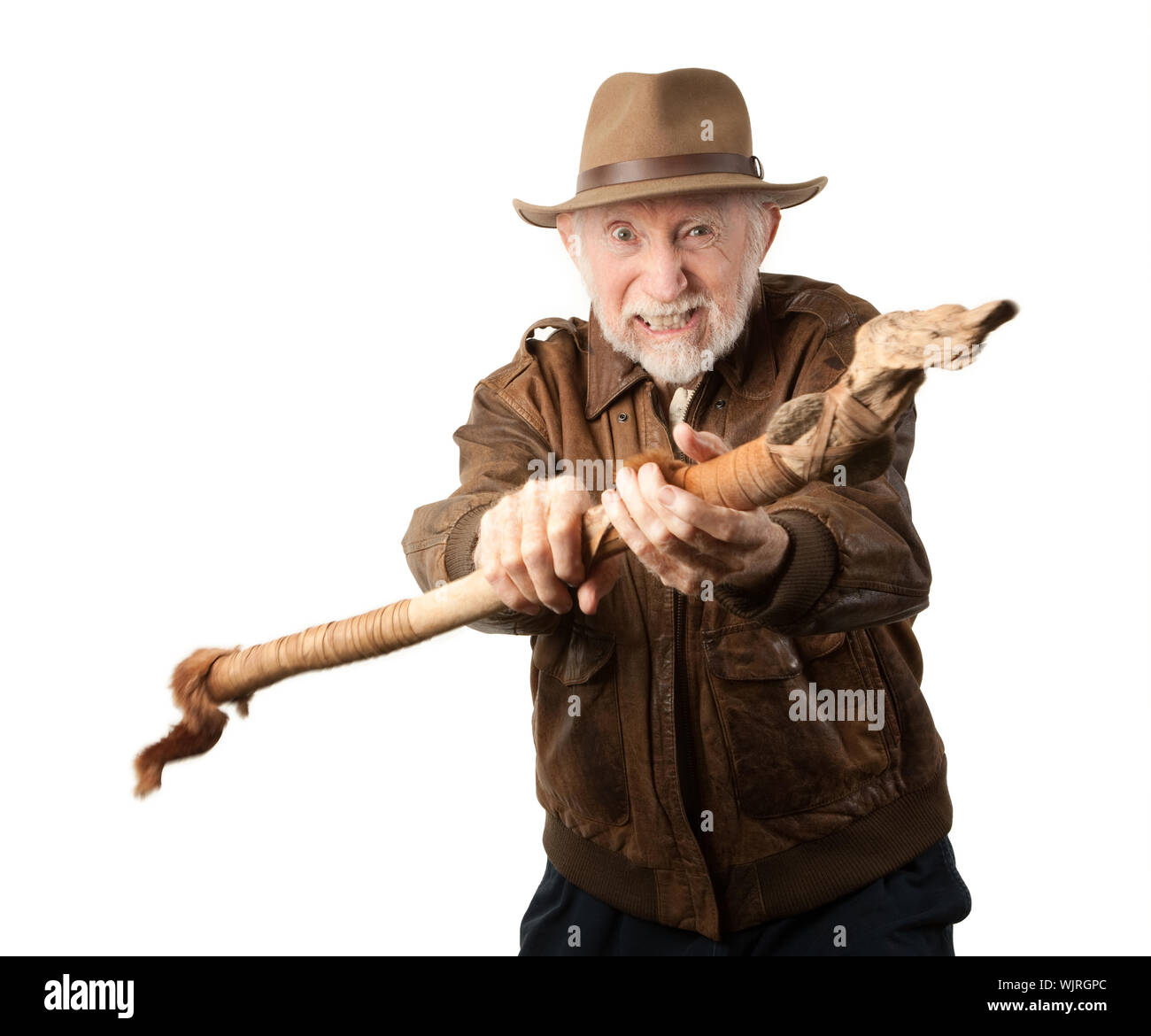 Adventurer or archaeologist in brown leather jacket defending himself ...