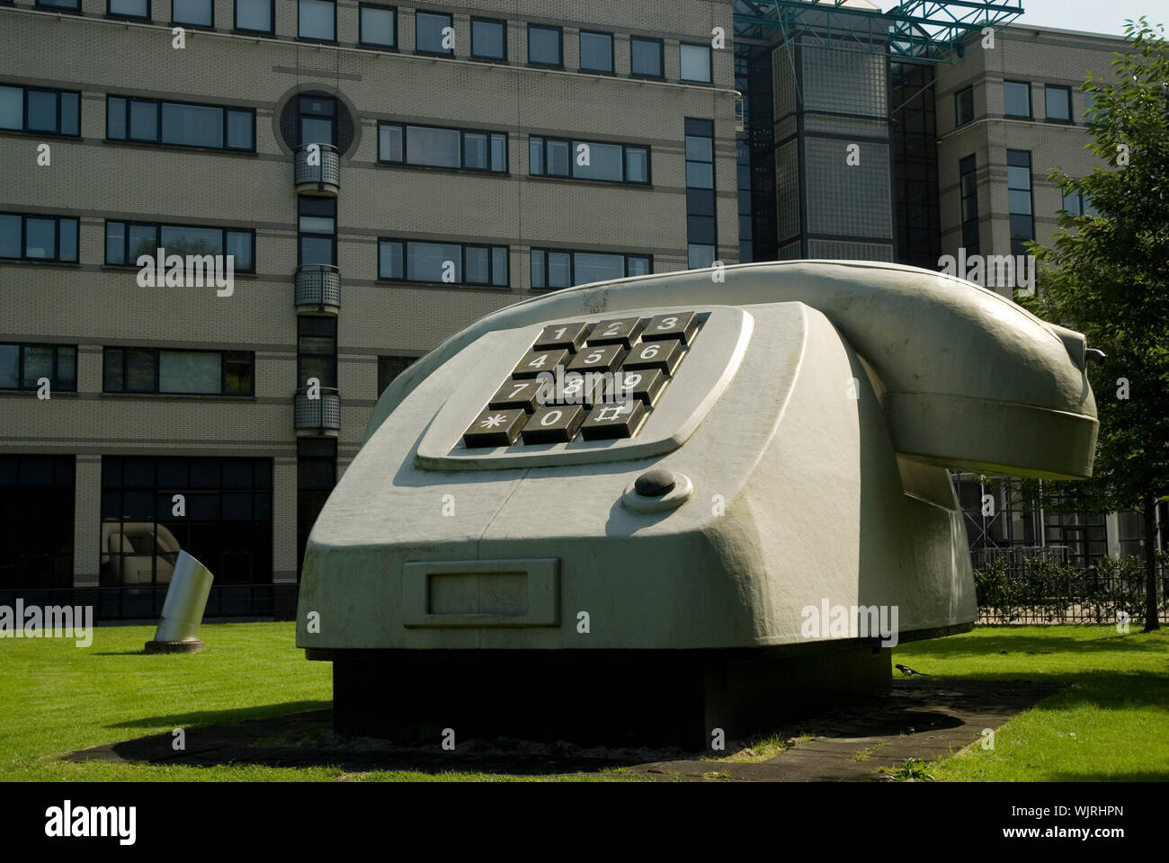 Very big telephone with office-building Stock Photo - Alamy