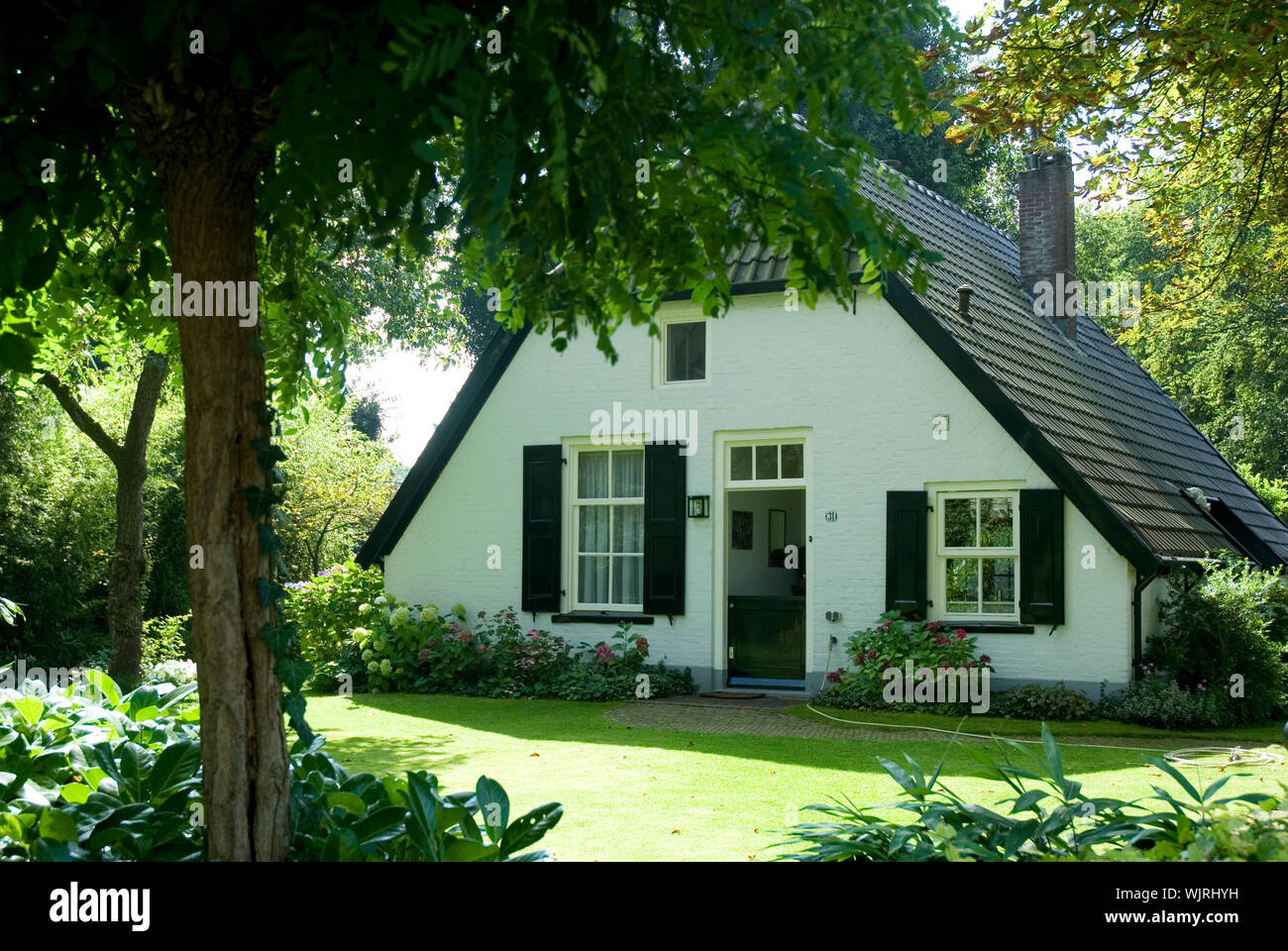 Idyllic Farmhouse in white and green Stock Photo - Alamy