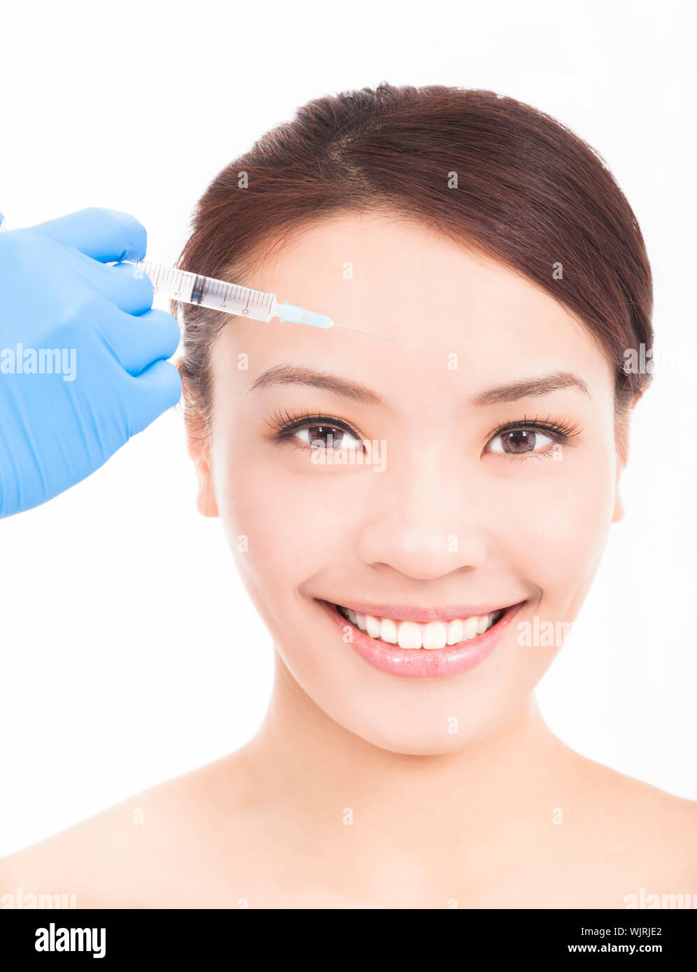Beautiful woman gets injection in her face Stock Photo - Alamy