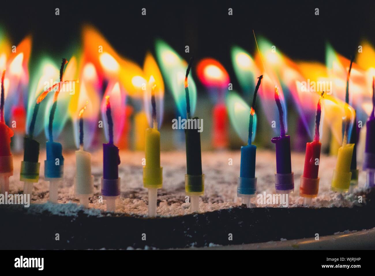 Birthday cake burning candles colorful hi-res stock photography and ...