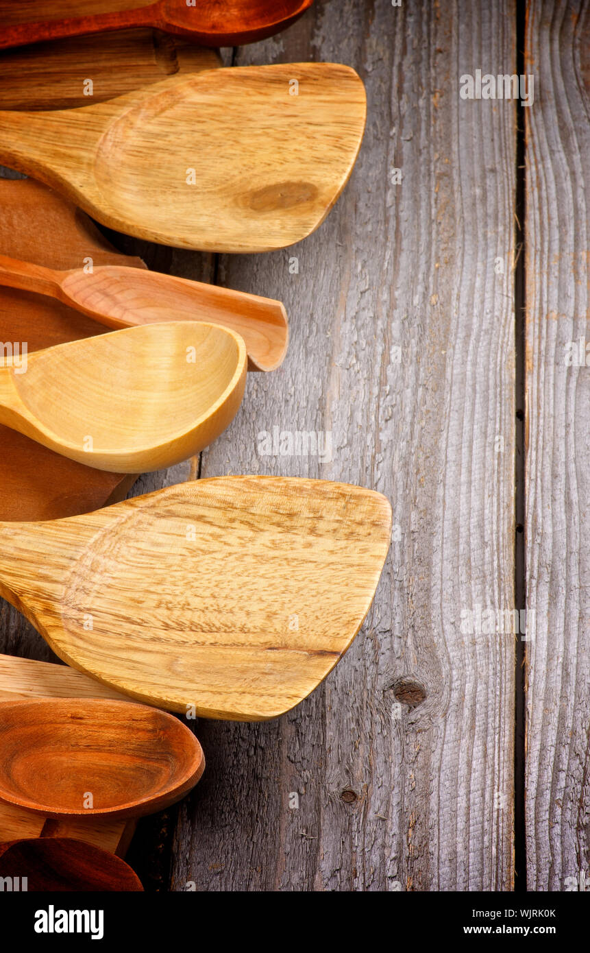 Border of Wooden Spoons and Cutting Boards isolated on Rustic Wooden background Stock Photo - Alamy