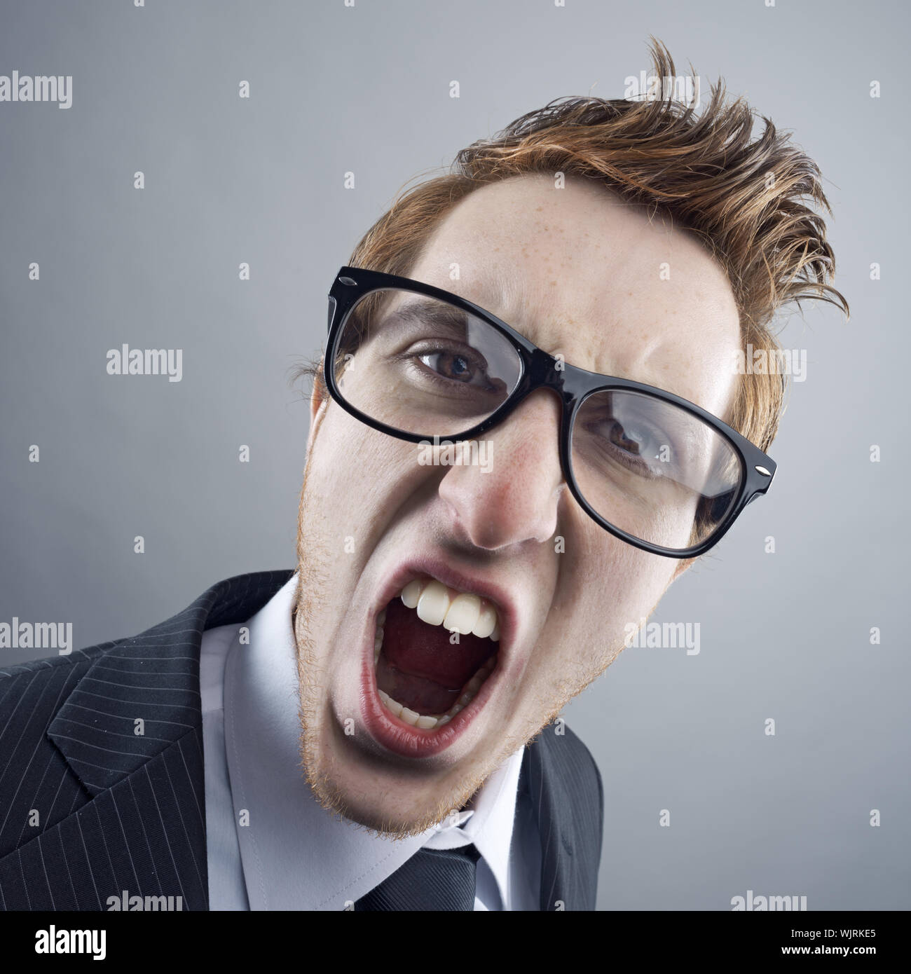 Portrait of mad Nerd businessman shouting at camera Stock Photo - Alamy