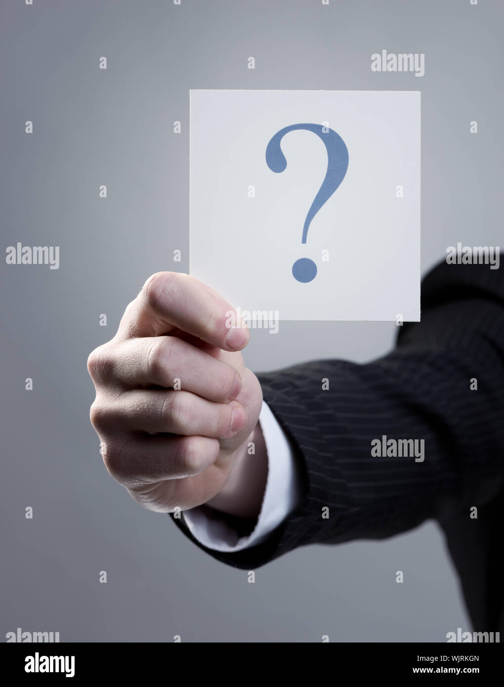 Businessman hand holding a question mark sign, close up Stock Photo - Alamy