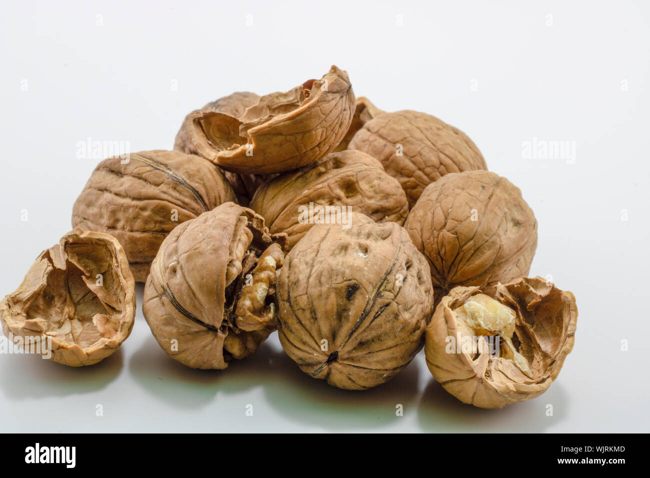 Broken walnut shells. Studio shoot on white background Stock Photo - Alamy