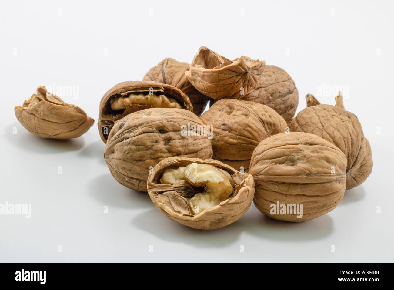 Broken walnut shells. Studio shoot on white background Stock Photo - Alamy