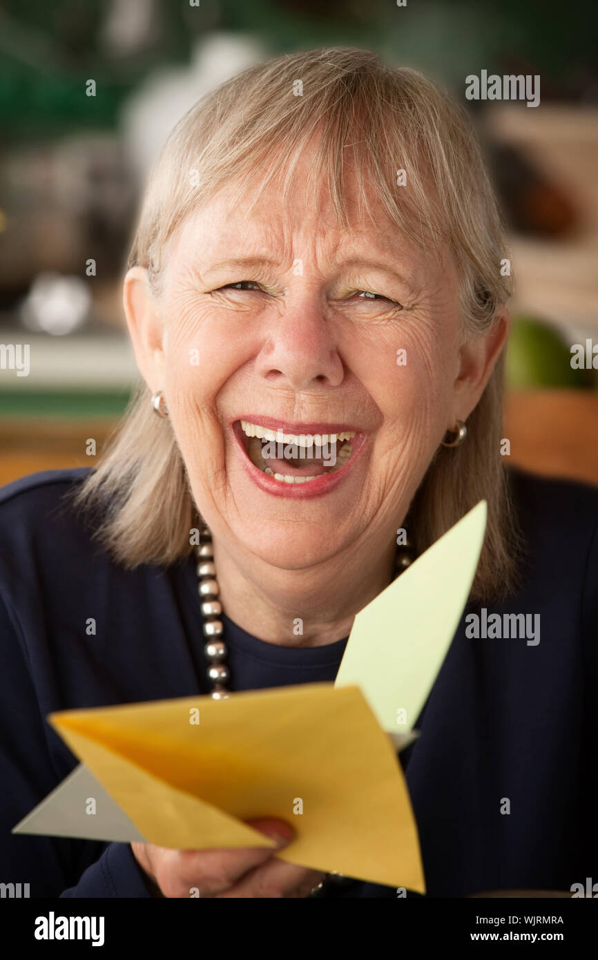 Elderly woman reading greeting hi-res stock photography and images - Alamy