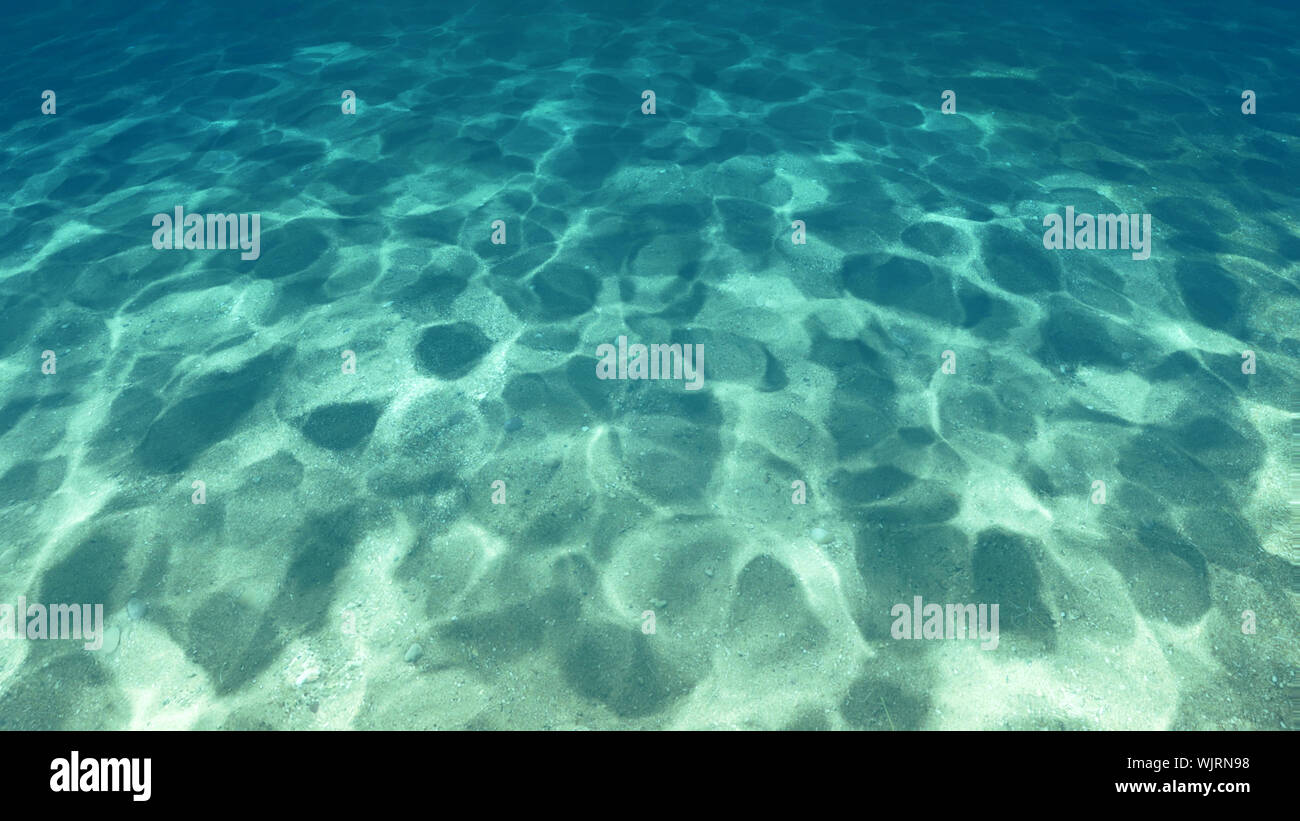 Surface of the sand under water in the sea Stock Photo - Alamy