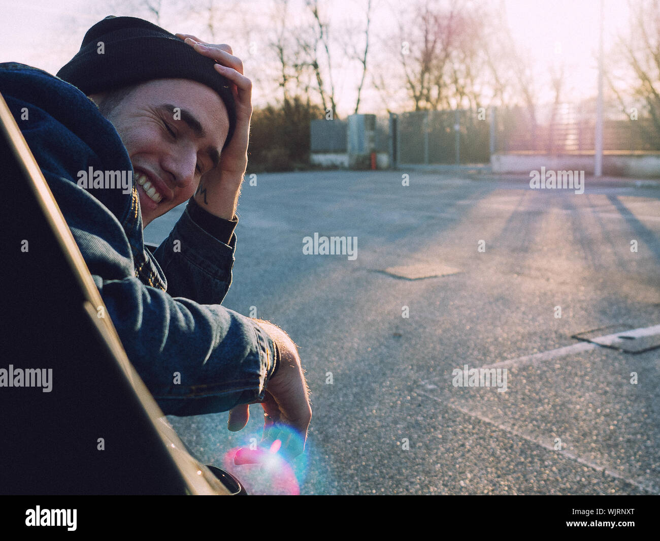 Man leaning out window hi-res stock photography and images - Alamy