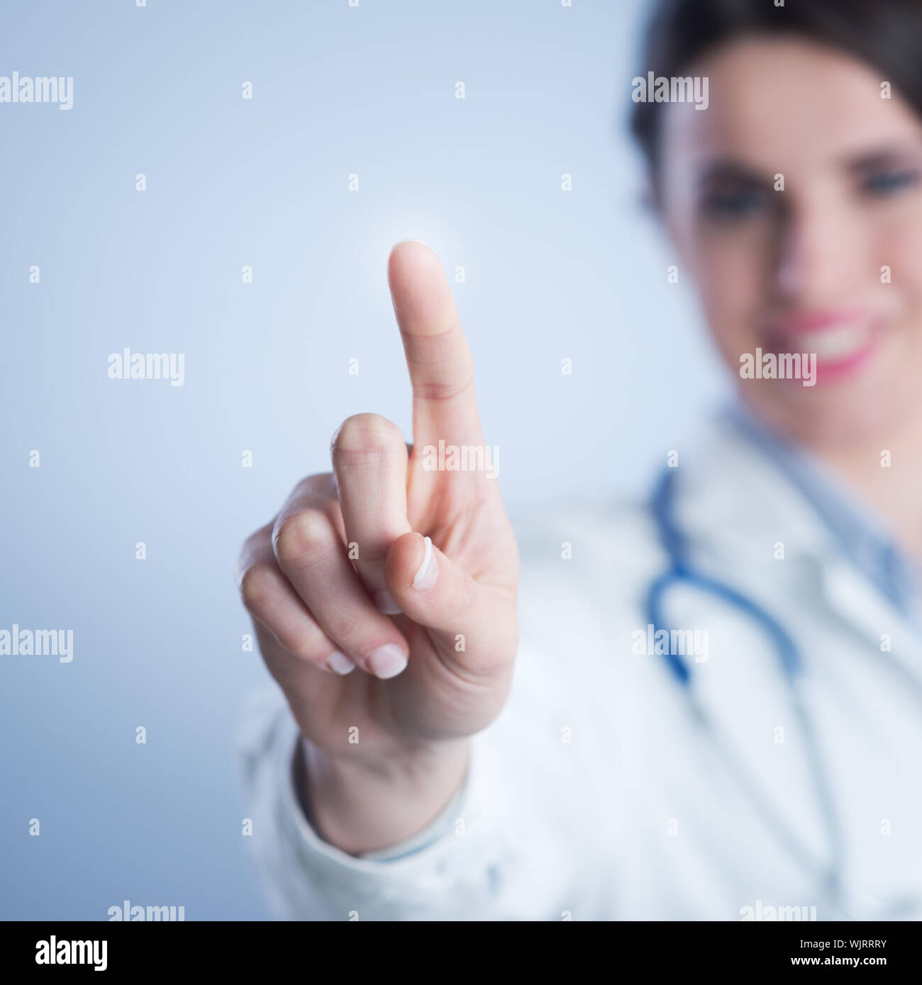 Young female doctor using a touch screen interface Stock Photo - Alamy