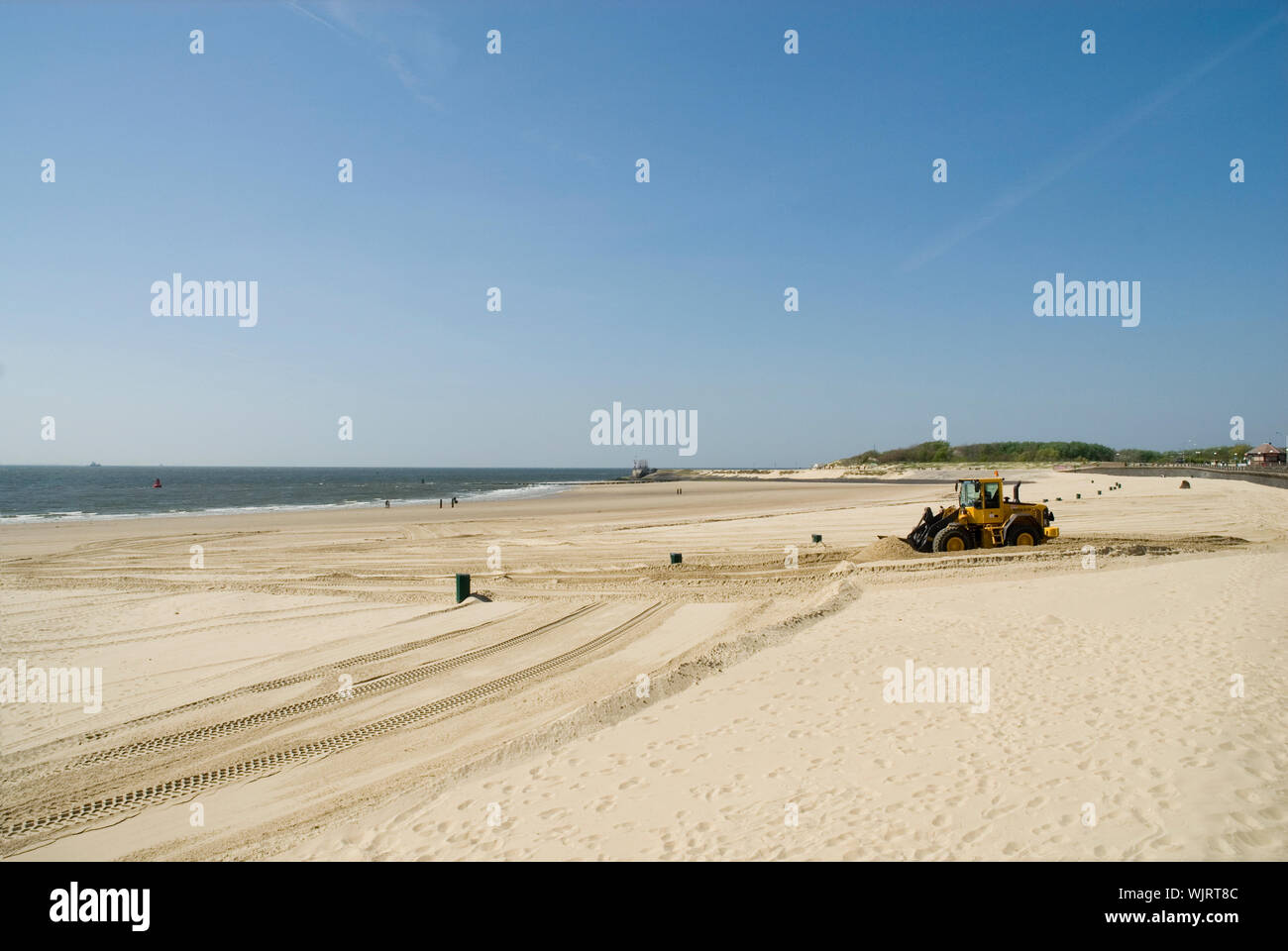 Bulldozer at work on the beach Stock Photo - Alamy