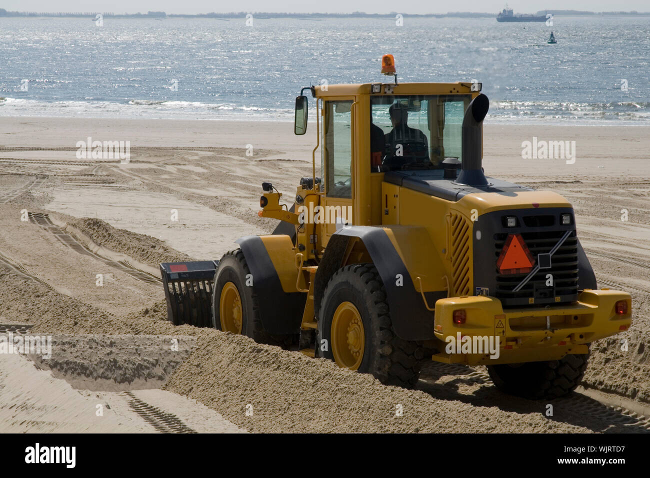 bulldozer at work on the beach Stock Photo - Alamy