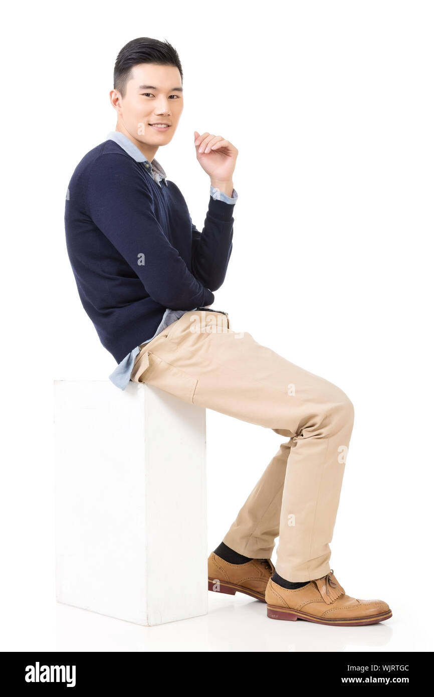 Handsome Asian guy sit pose, full length portrait isolated on white ...
