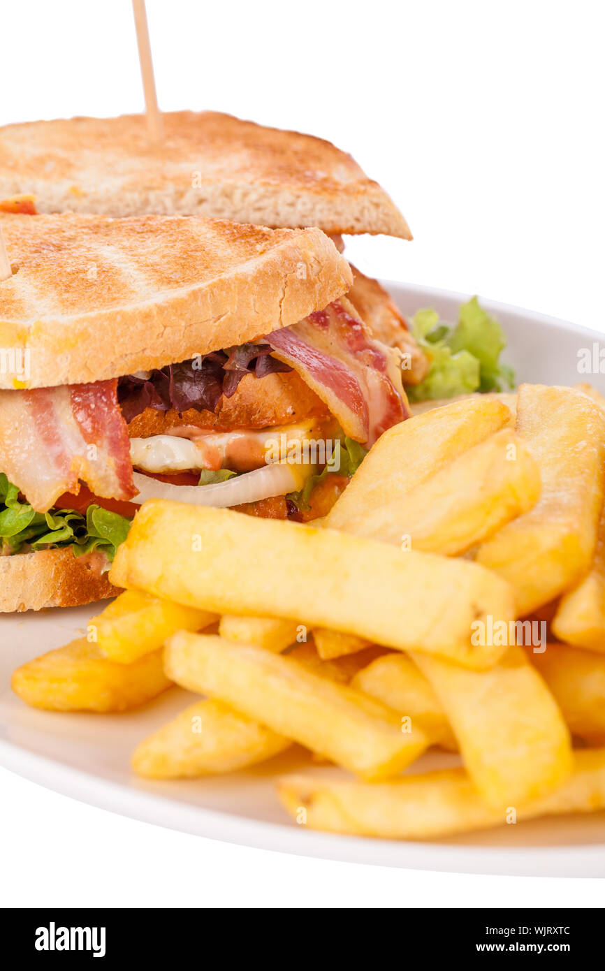 Club sandwich on toasted white bread with a meat filling served with ...