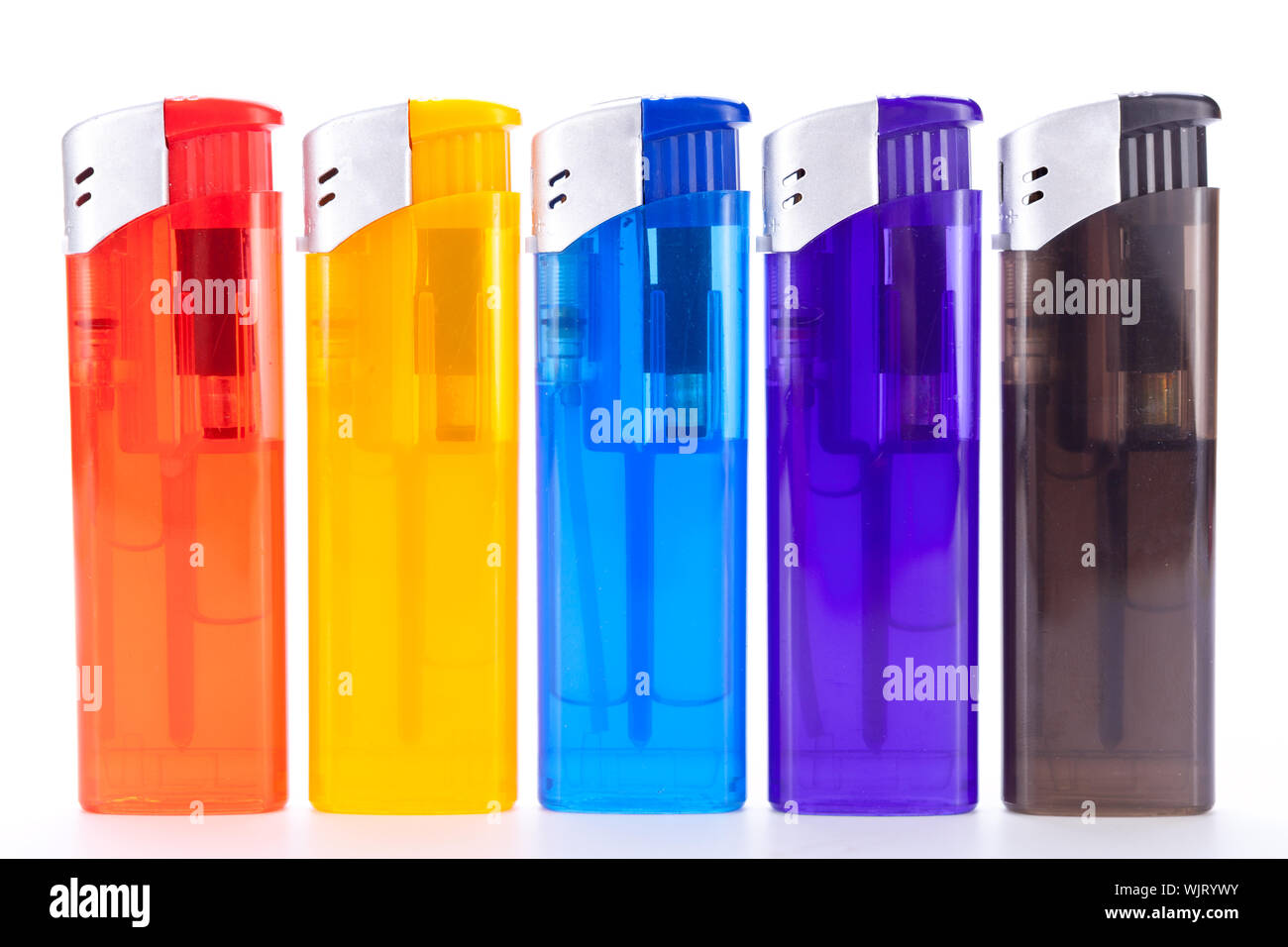 Row of vividly coloured plastic disposable lighters for smokers in red ...