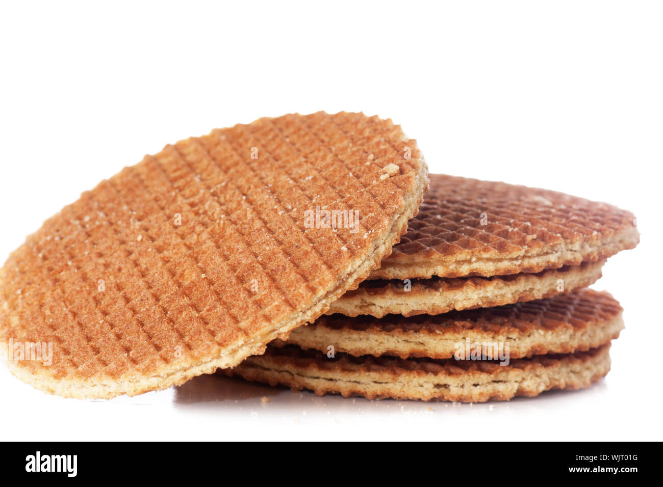 A stack of golden round waffles isolated over white background Stock ...