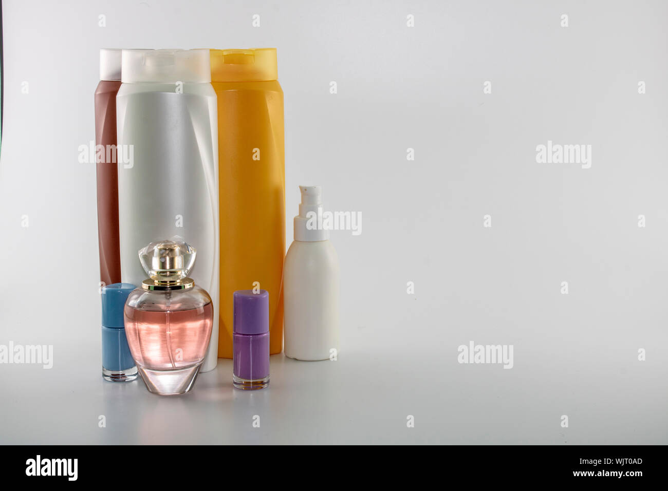 Shampoo, sun cream, nail polish, parfum. Isolated on white background ...