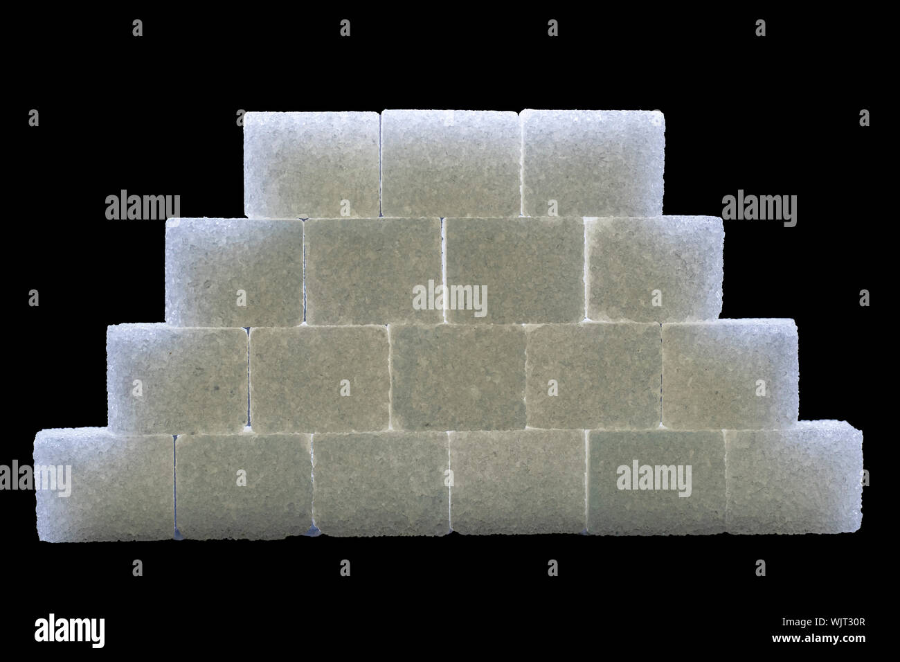Sugar cubes lined up in pyramid shape. Black background Stock Photo - Alamy