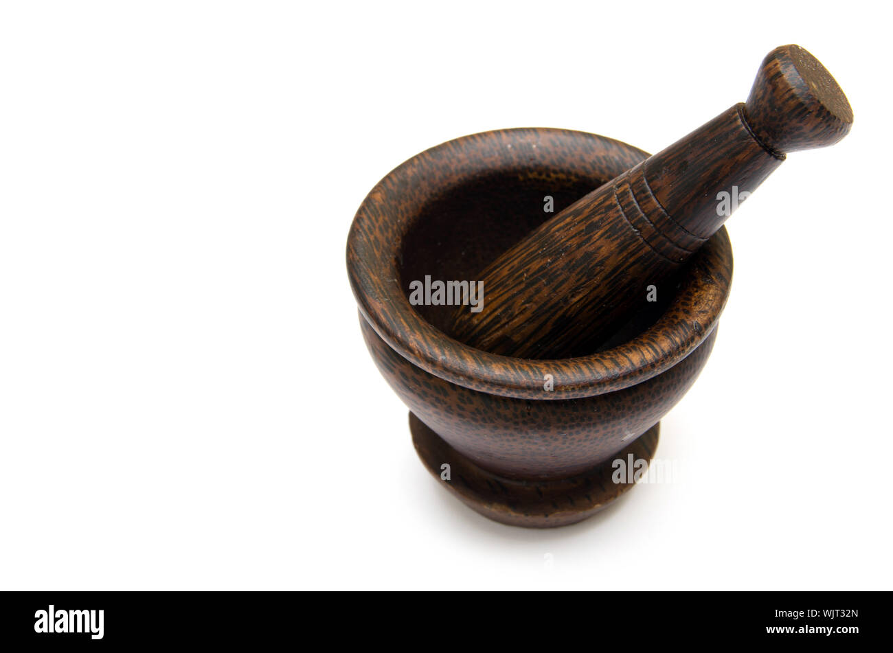Handmade wooden mortar isolated on white background Stock Photo - Alamy
