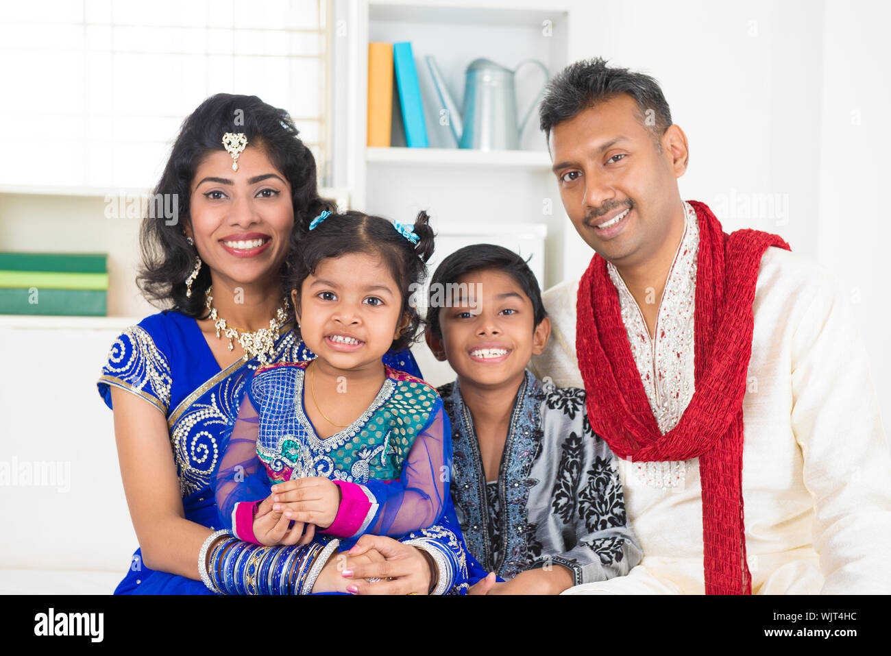 Happy Indian Family With House