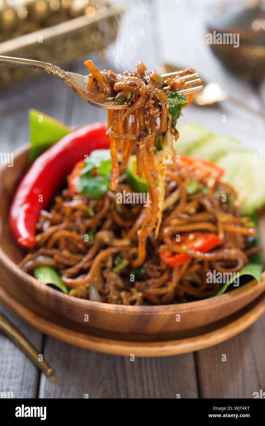 Indonesian and Malaysian cuisine, spicy fried noodles, mi goreng or mee ...