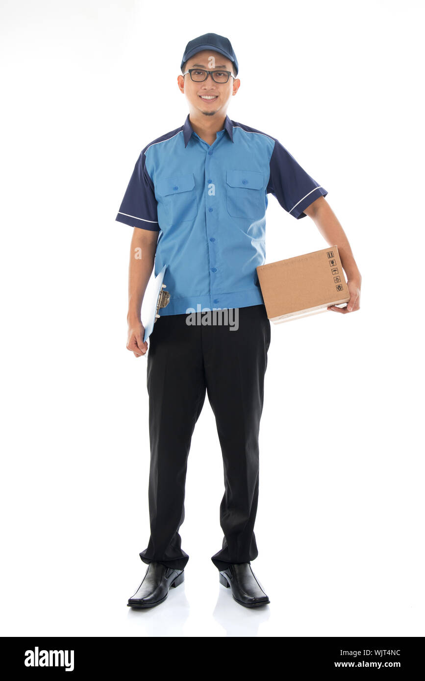 Delivery person delivering packages holding clipboard and package ...