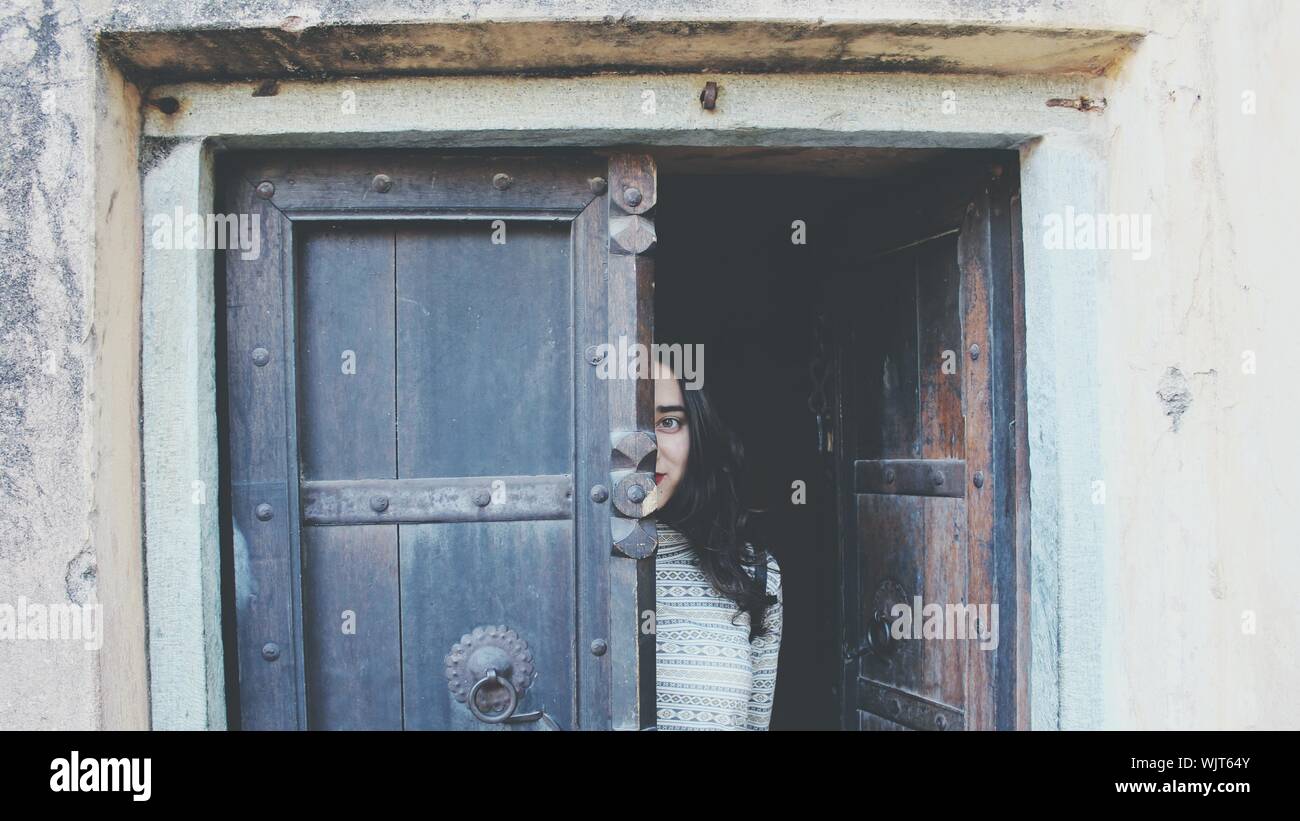 Standing behind door hi-res stock photography and images - Alamy