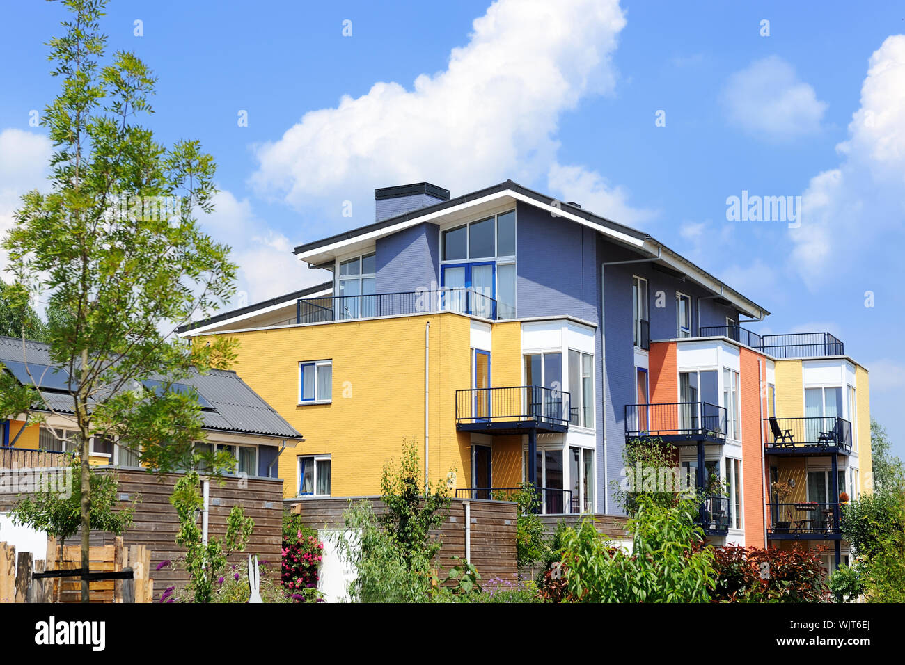 colorful exterior building with apartments Stock Photo - Alamy