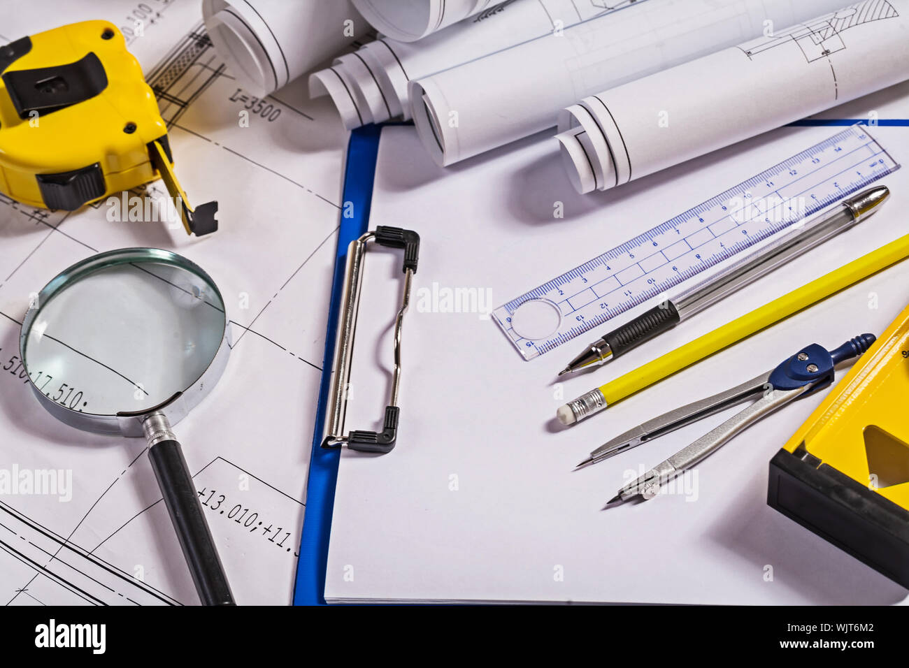 set of architect tools on blueprints Stock Photo - Alamy