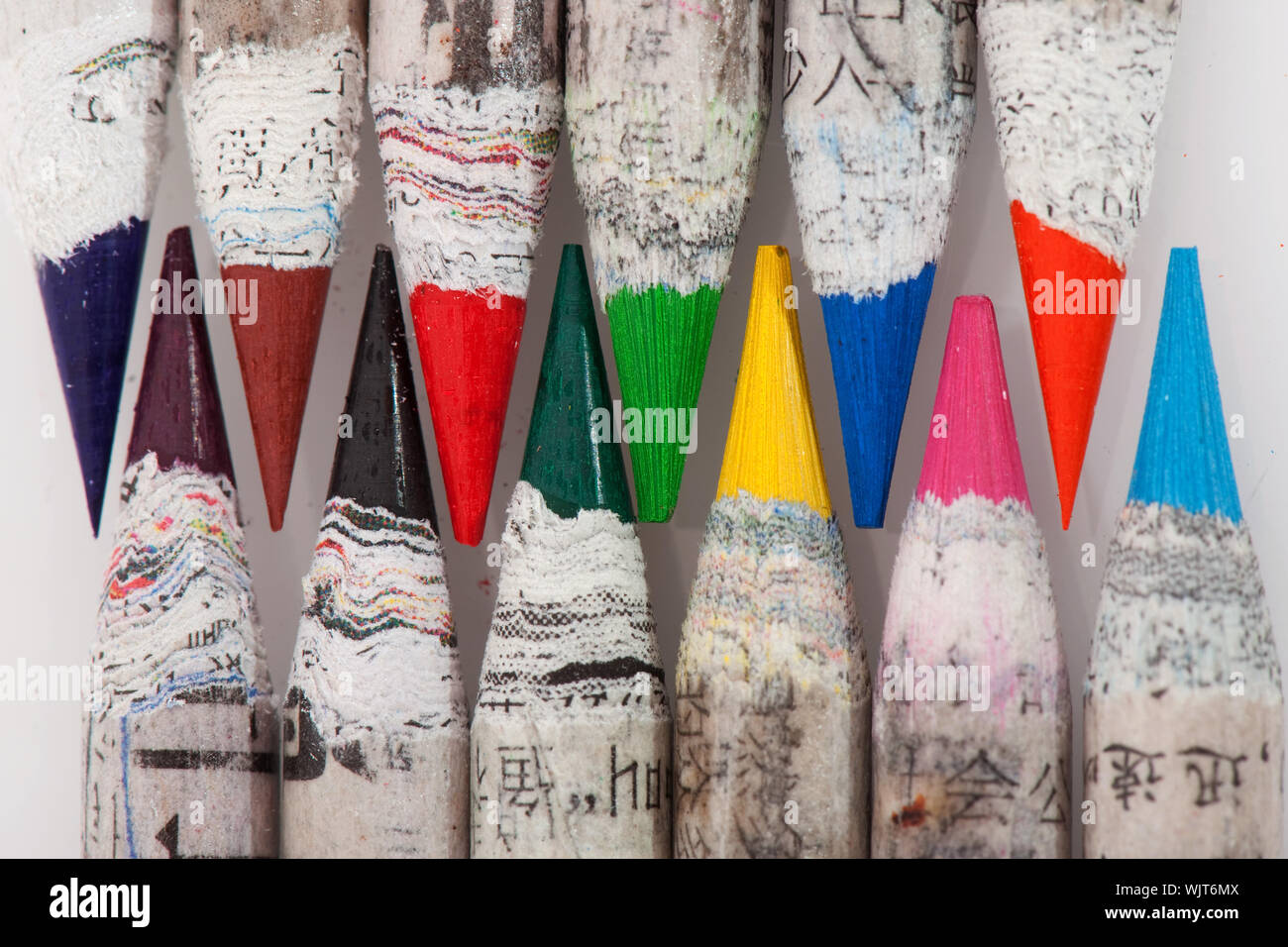 Chinese color pencils made from newspapers over white Stock Photo - Alamy