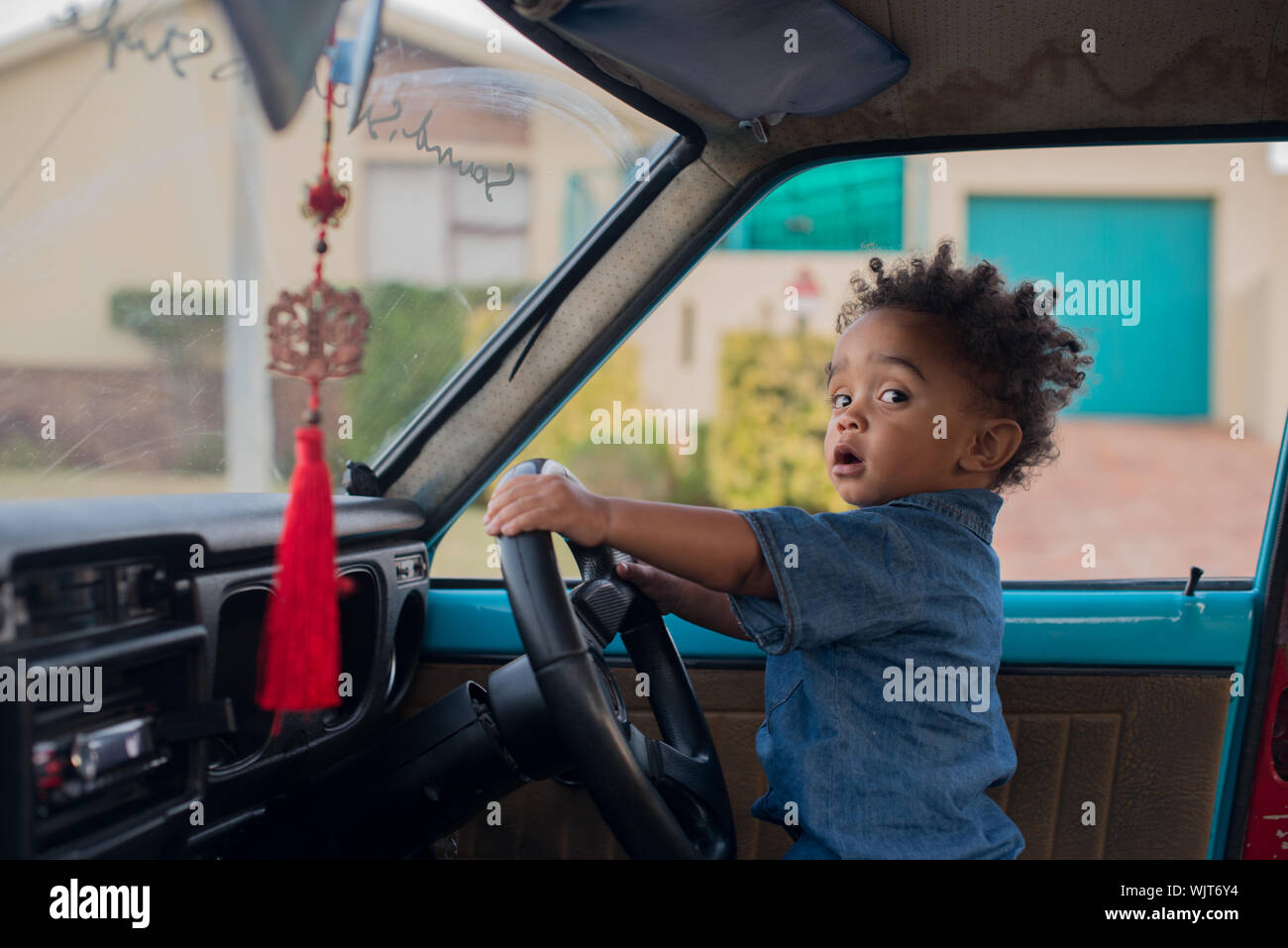 Boy playing wheel hi-res stock photography and images - Alamy