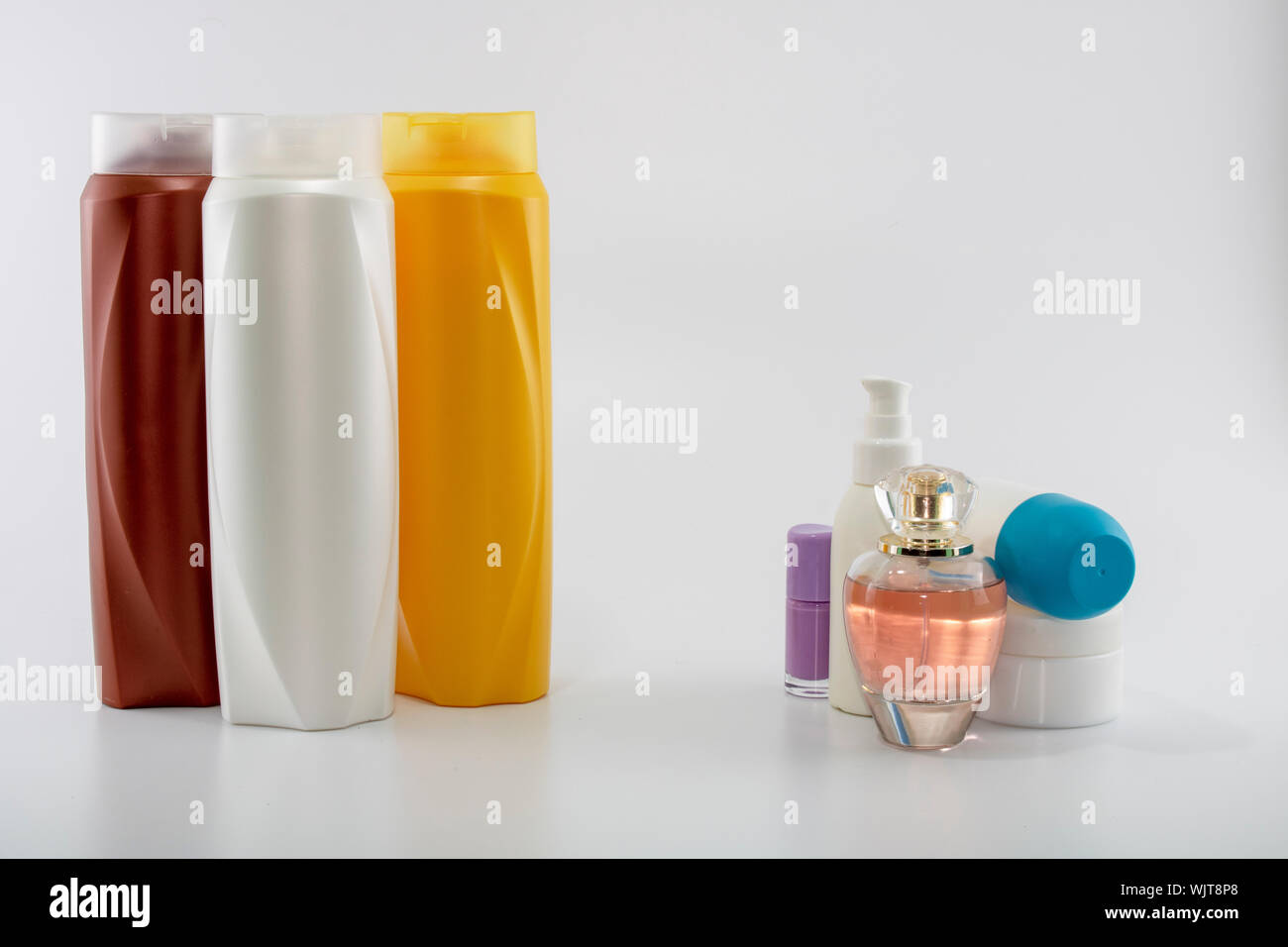 Shampoo, sun cream, nail polish, parfum. Isolated on white background ...