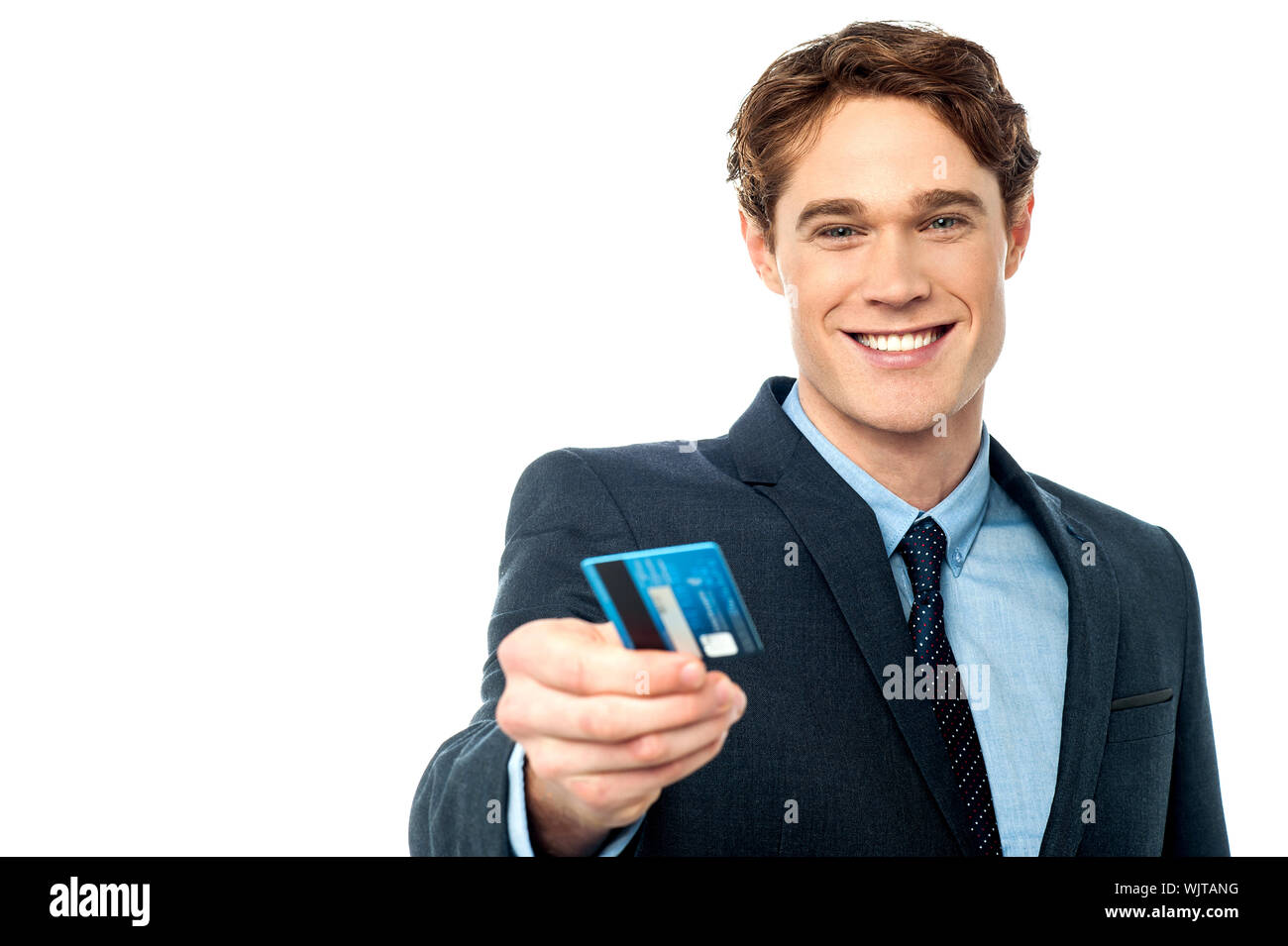 Smiling businessman handing over his debit card Stock Photo - Alamy