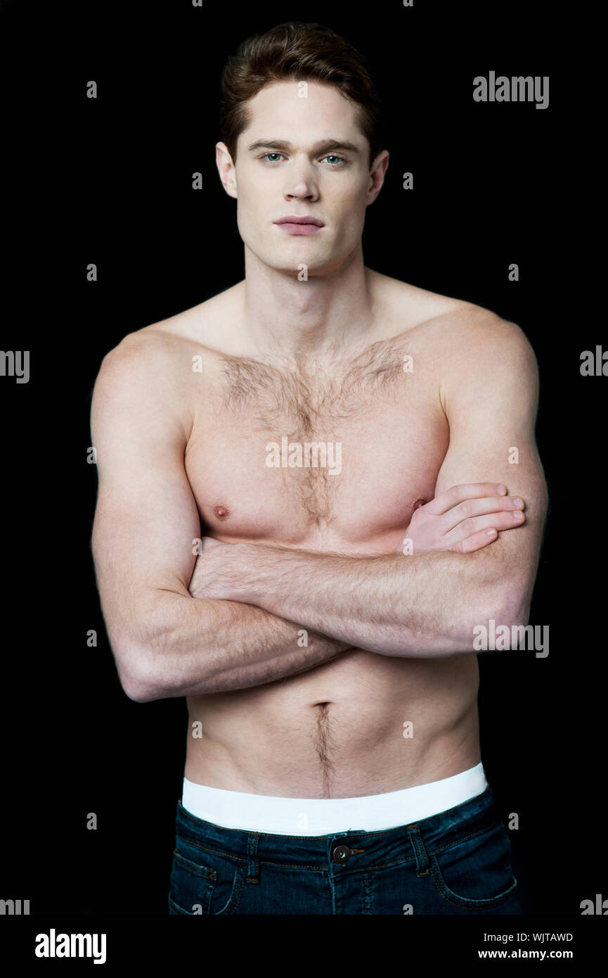 Strong muscular man shirtless, arms crossed Stock Photo - Alamy
