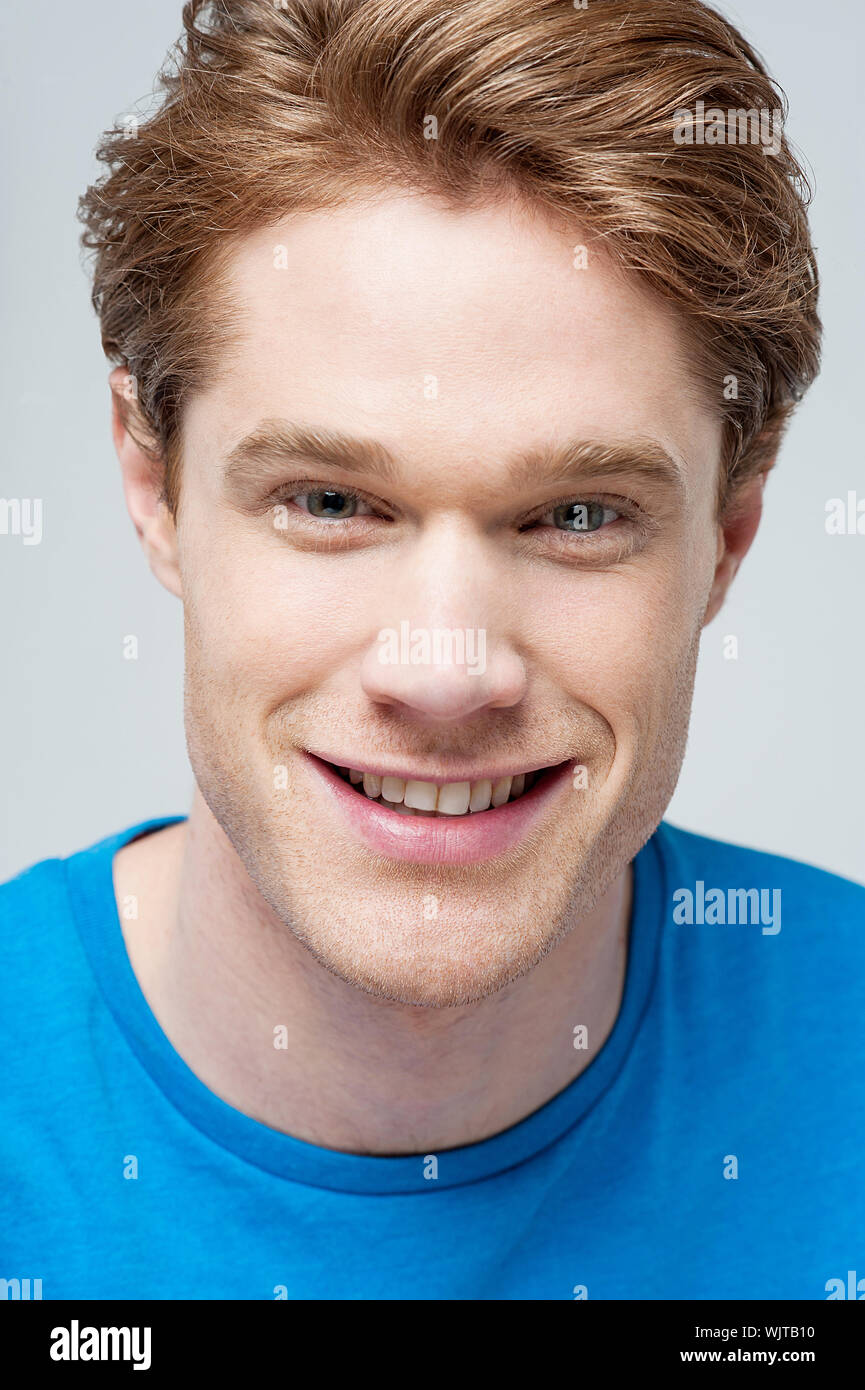 Handsome young smiling male model Stock Photo - Alamy