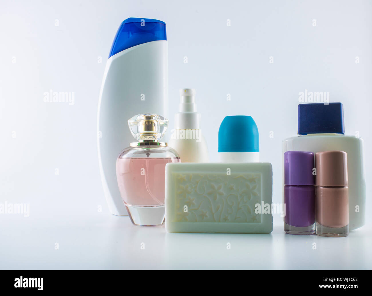 Shampoo, sun cream, nail polish, parfum. Isolated on white background ...