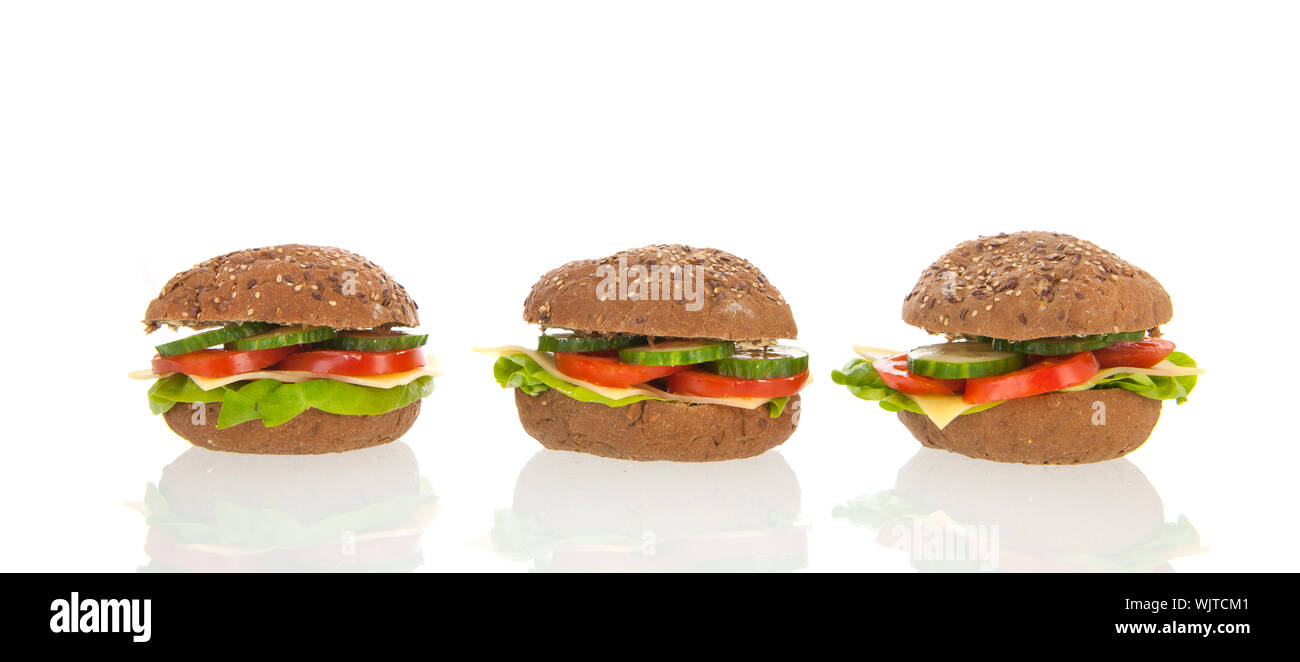 Three healthy brown bread rolls isolated over white background Stock ...